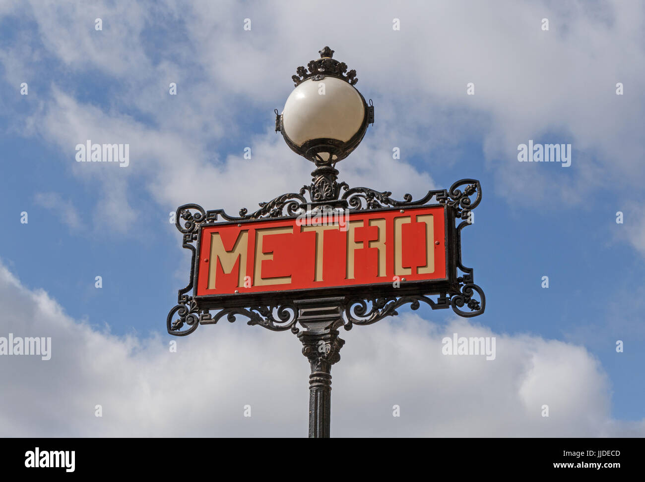Metro sign in Paris against blue sky with clouds Stock Photo - Alamy