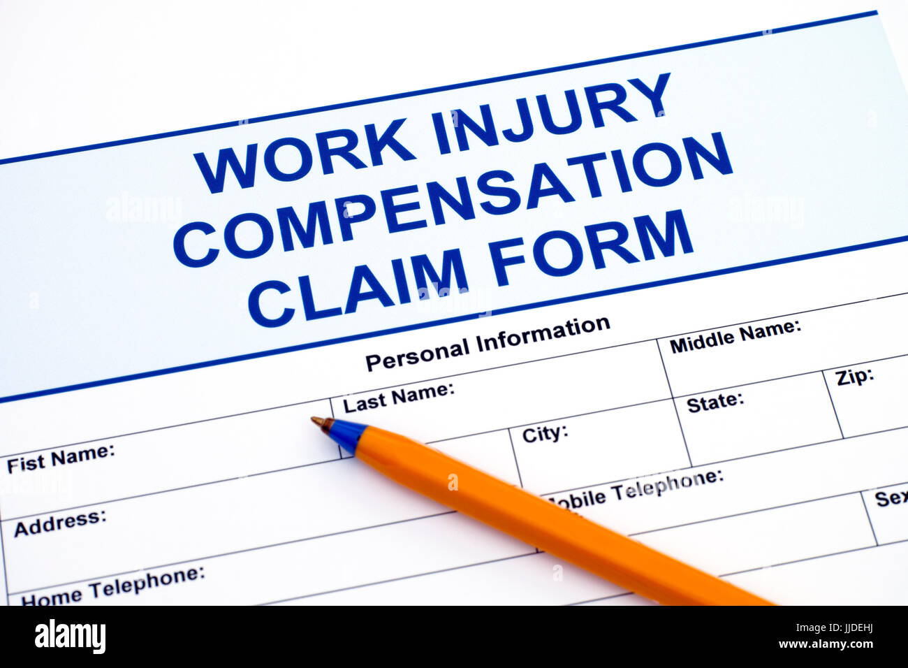 Work Injury Compensation Claim Form with ballpoint pen Stock Photo - Alamy