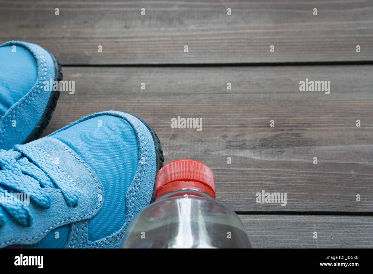 necessary equipment for running. blue sneakers on dark background with ...