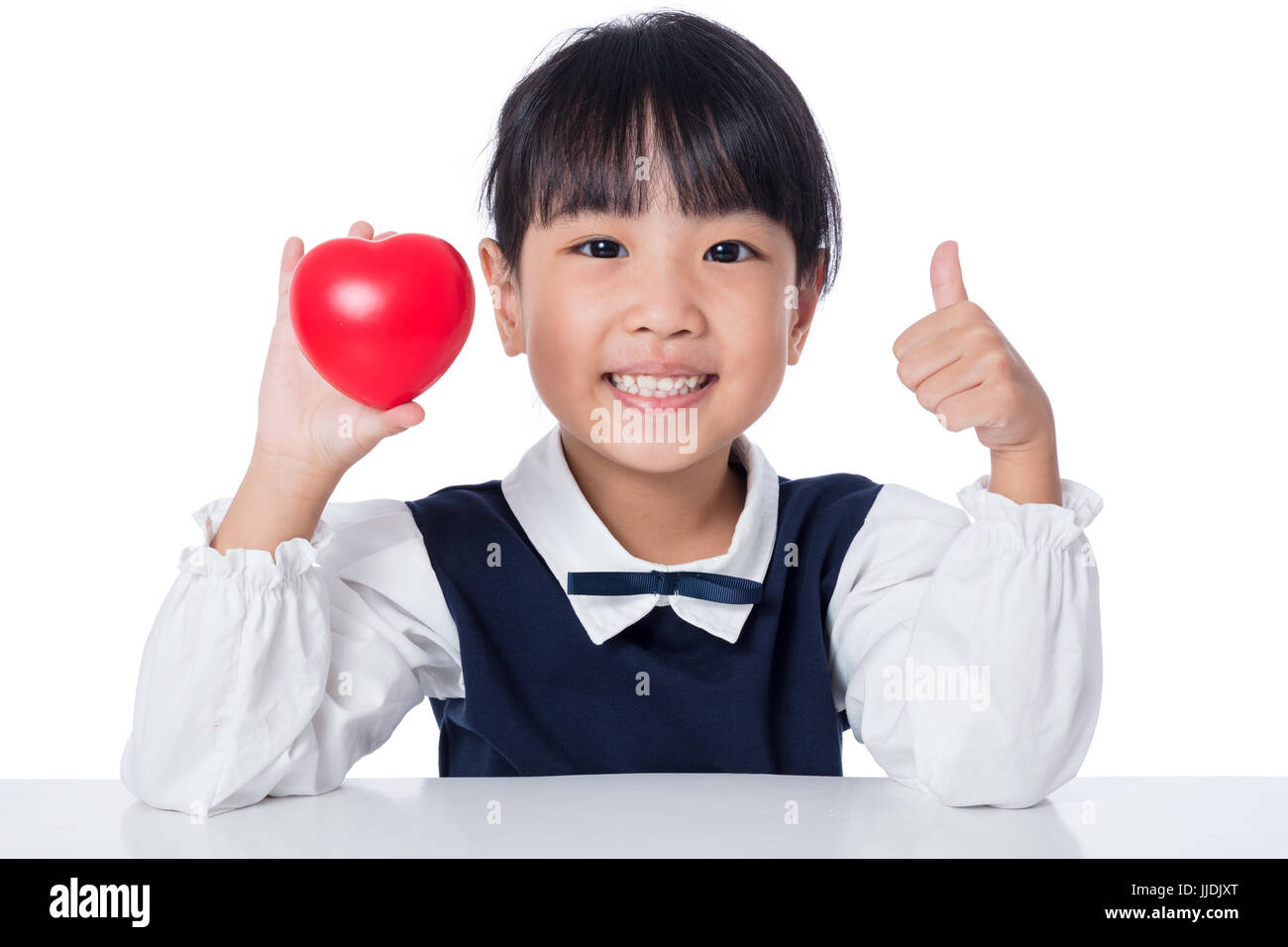 Asian Little Chinese Girl Holding Red Heart in isolated White ...