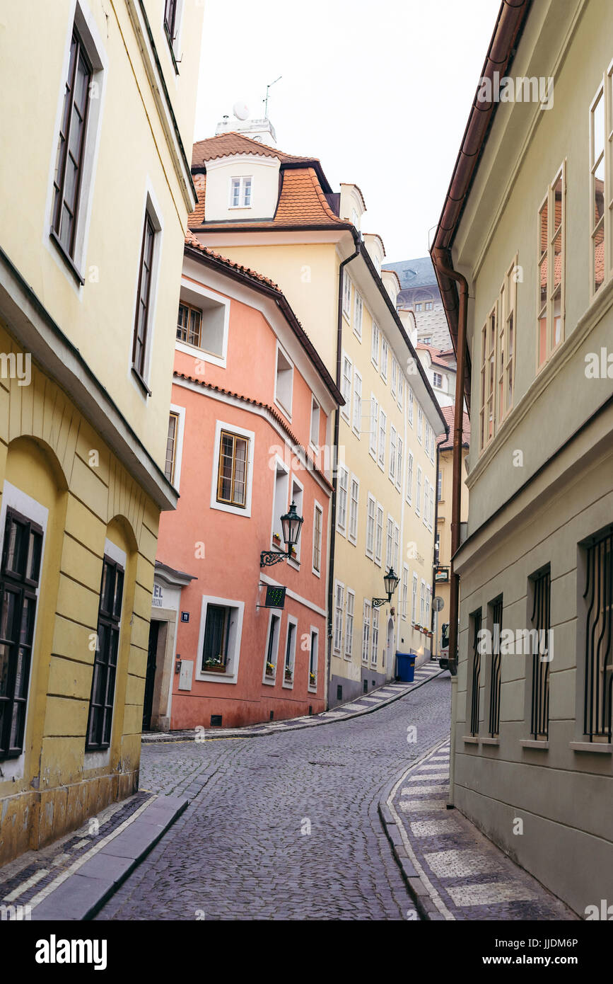 Close-up vertical view of the narrow alley with colourful buildings ...