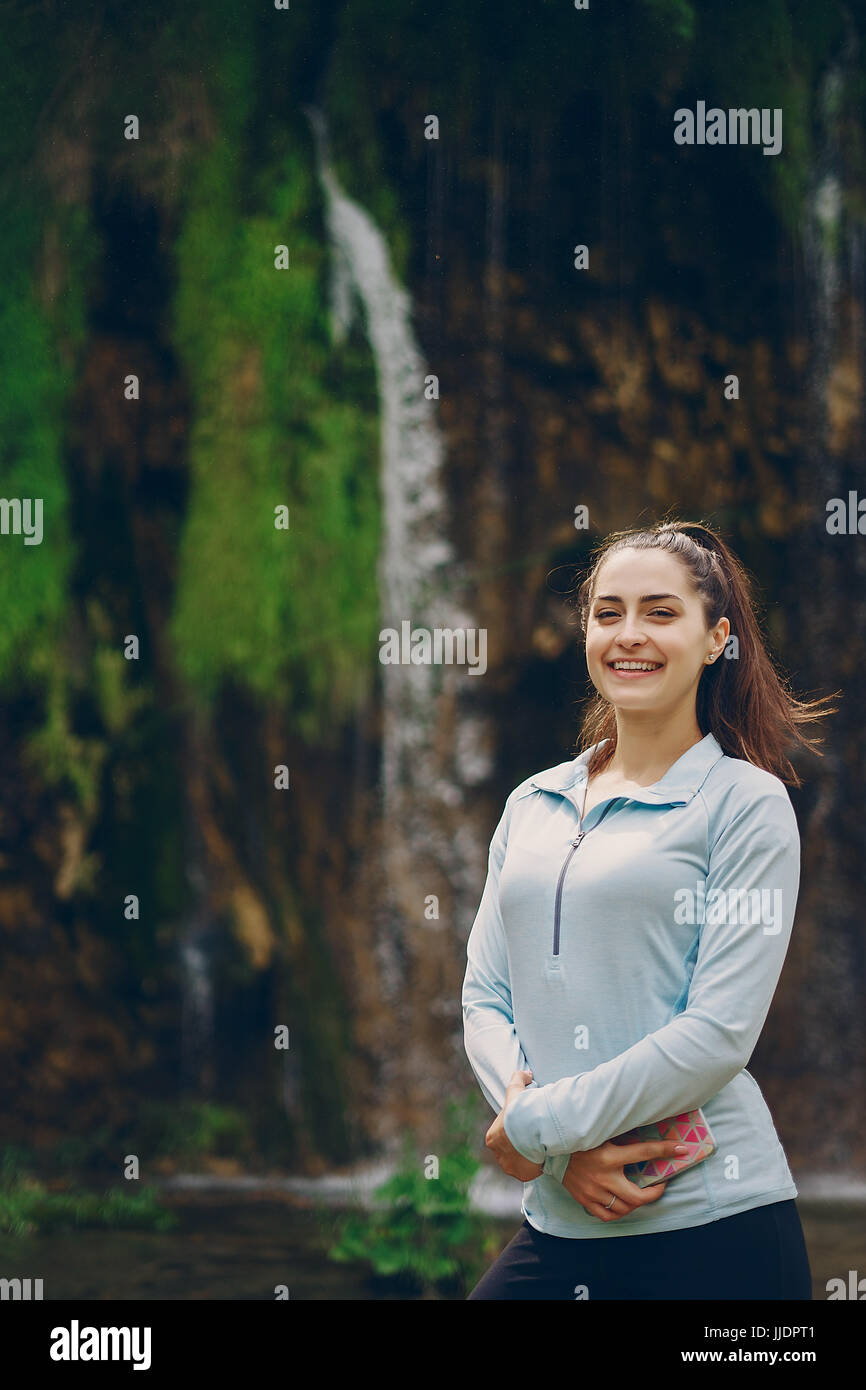 girl near the waterfall Stock Photo - Alamy