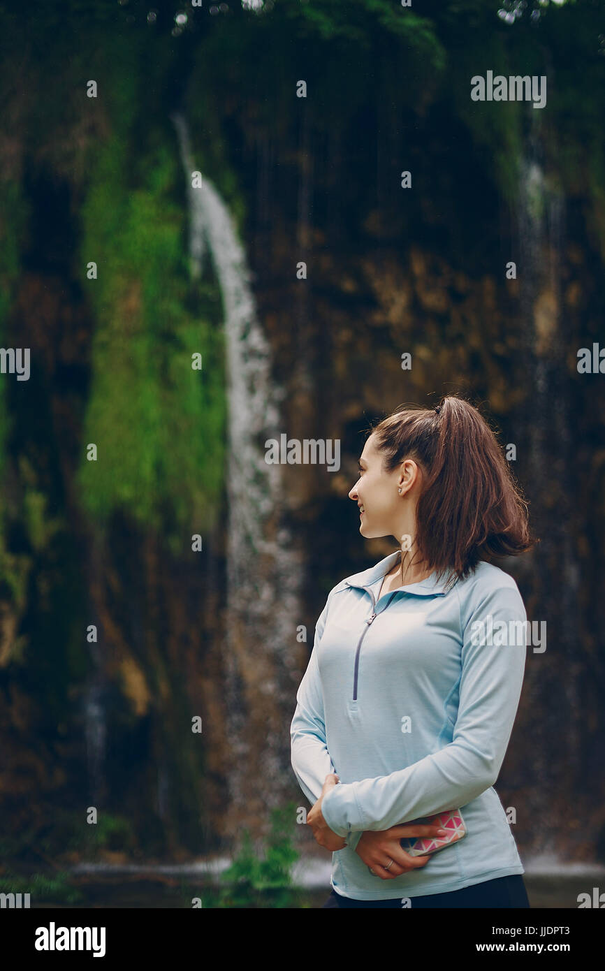 girl near the waterfall Stock Photo - Alamy