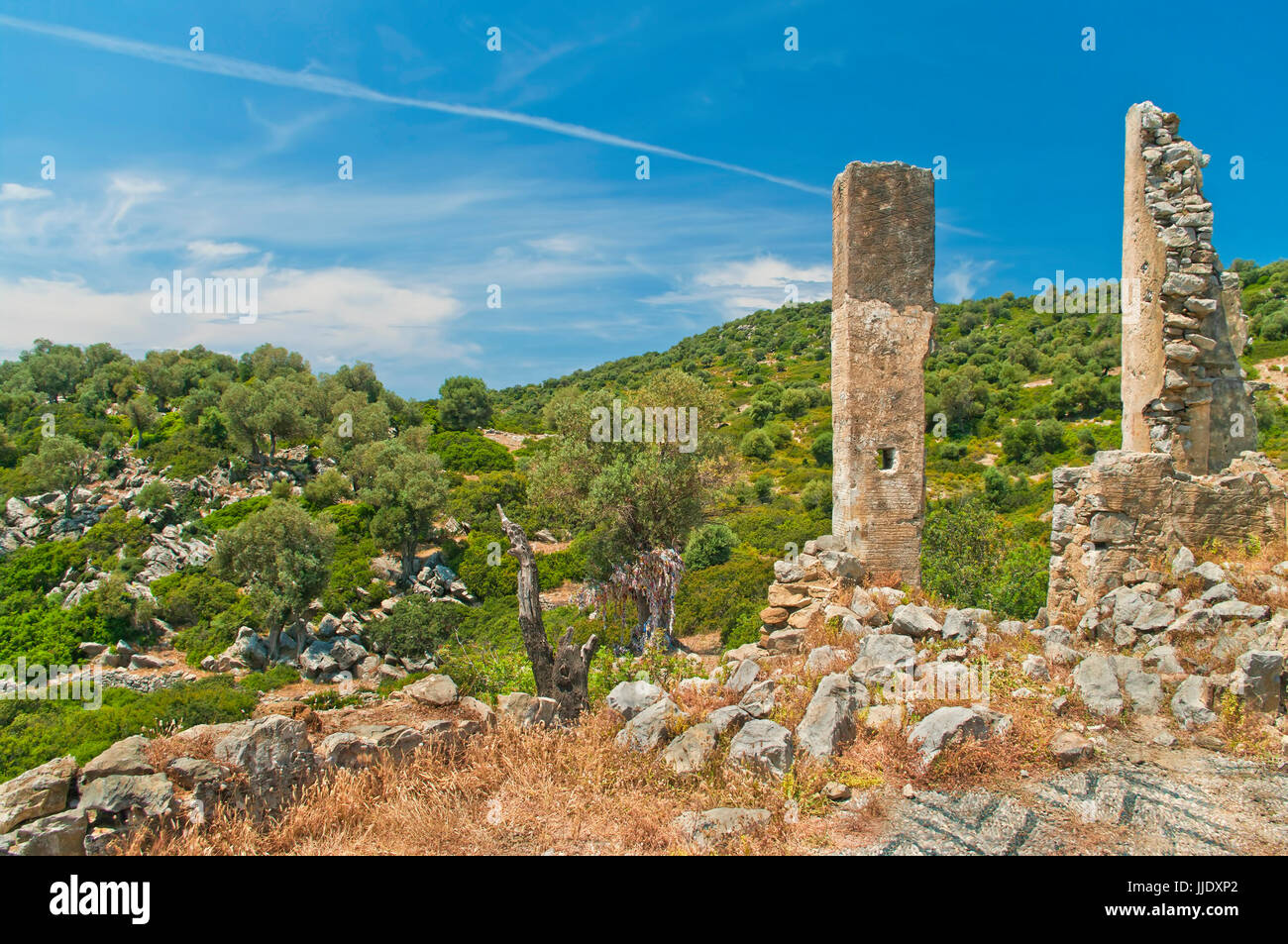 ruins of medieval byzantine church with green hills and blue sky at ...