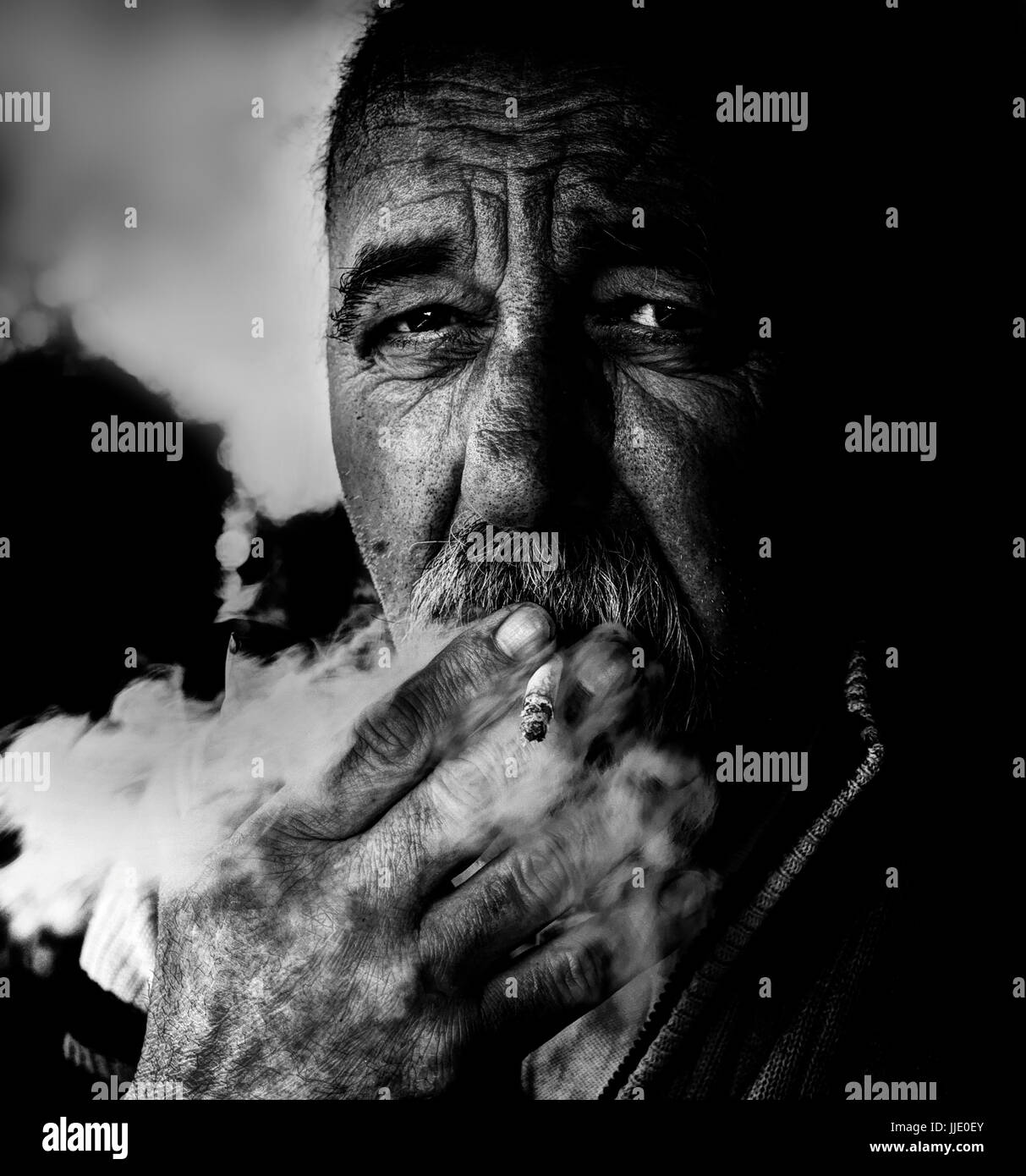 Old man smoking cigar Black and White Stock Photos & Images - Alamy