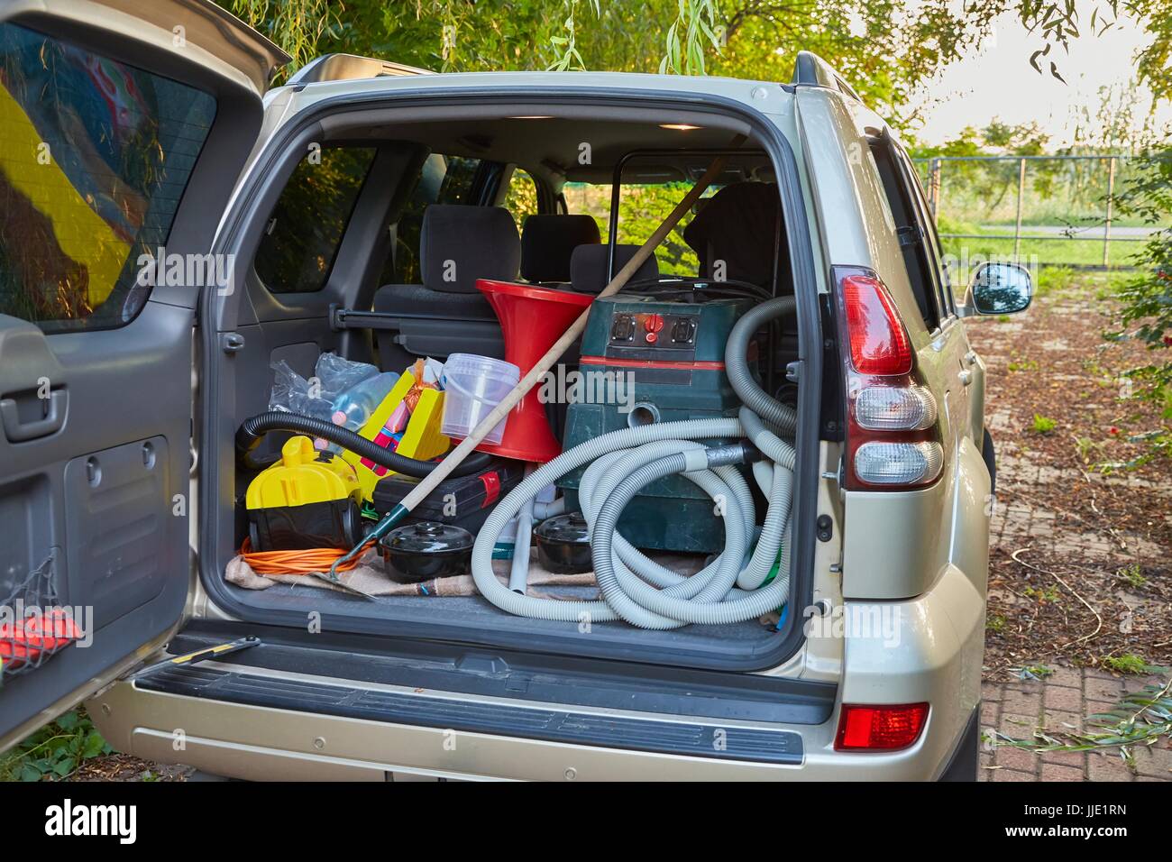 Trunk of a car loaded with equipment Stock Photo - Alamy