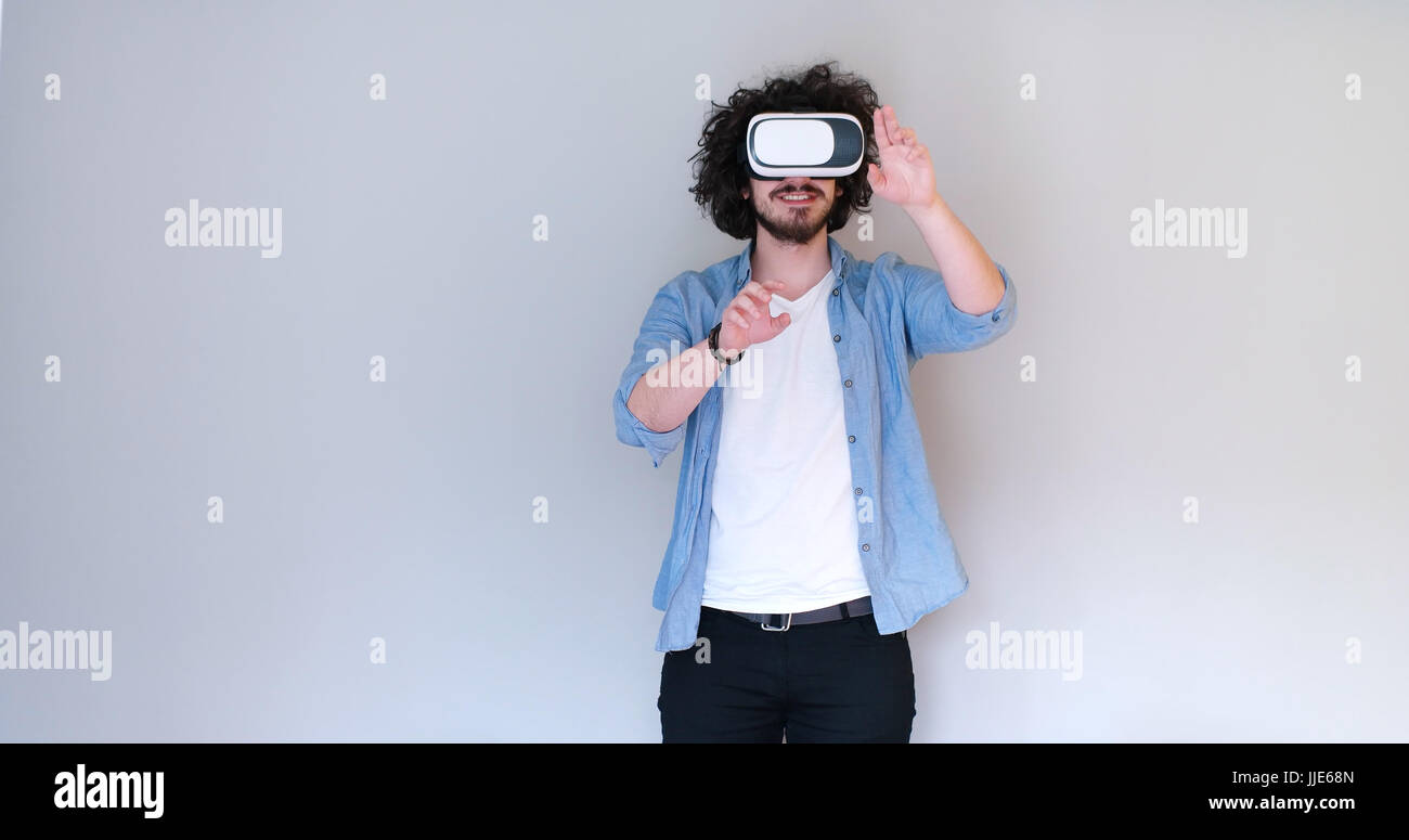 Happy man getting experience using VR headset glasses of virtual ...