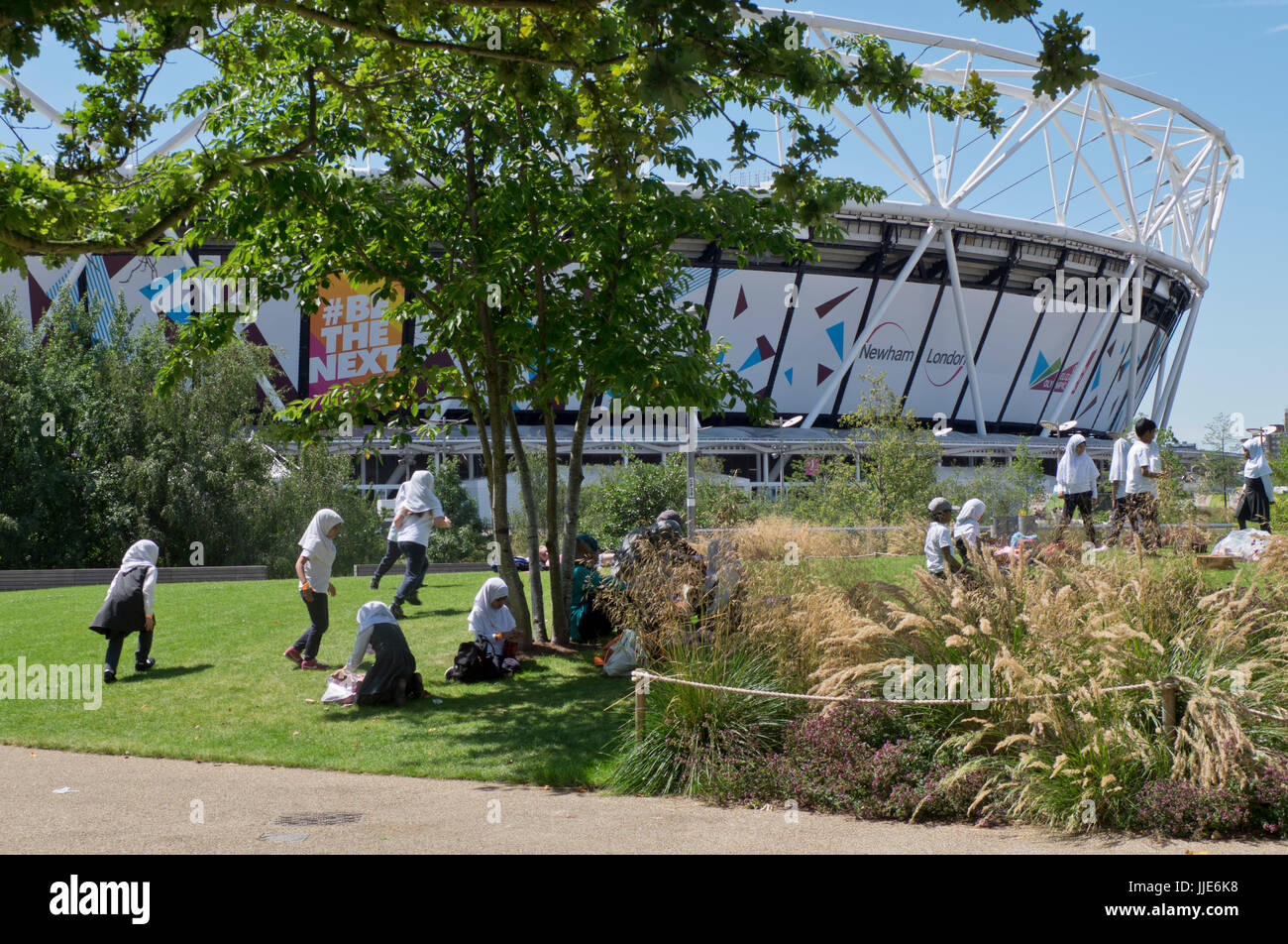 Muslim children playing at playground by Olympic Stadium in London ...