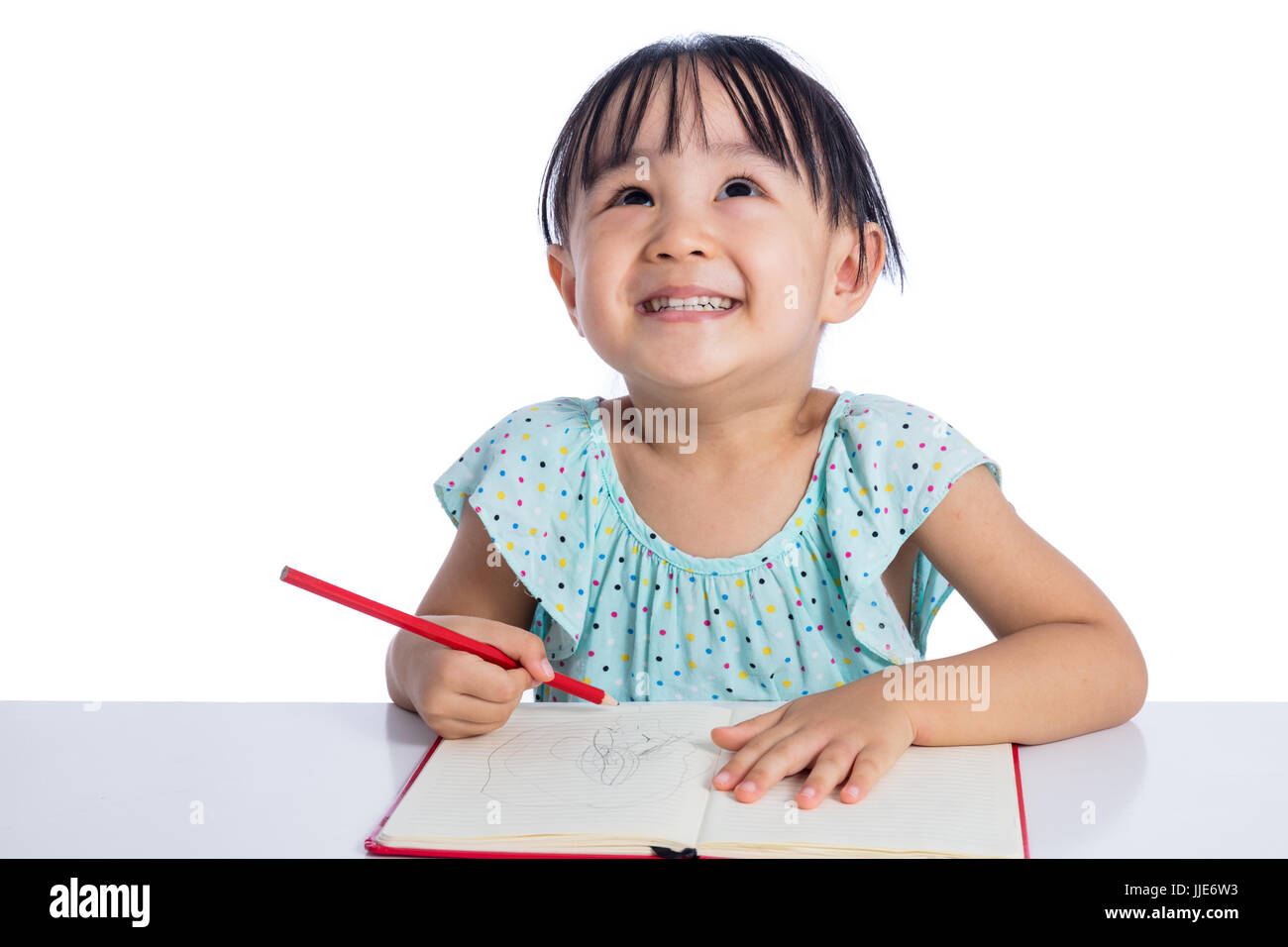 Asian Little Chinese girl writing on exercise book in isolated white ...