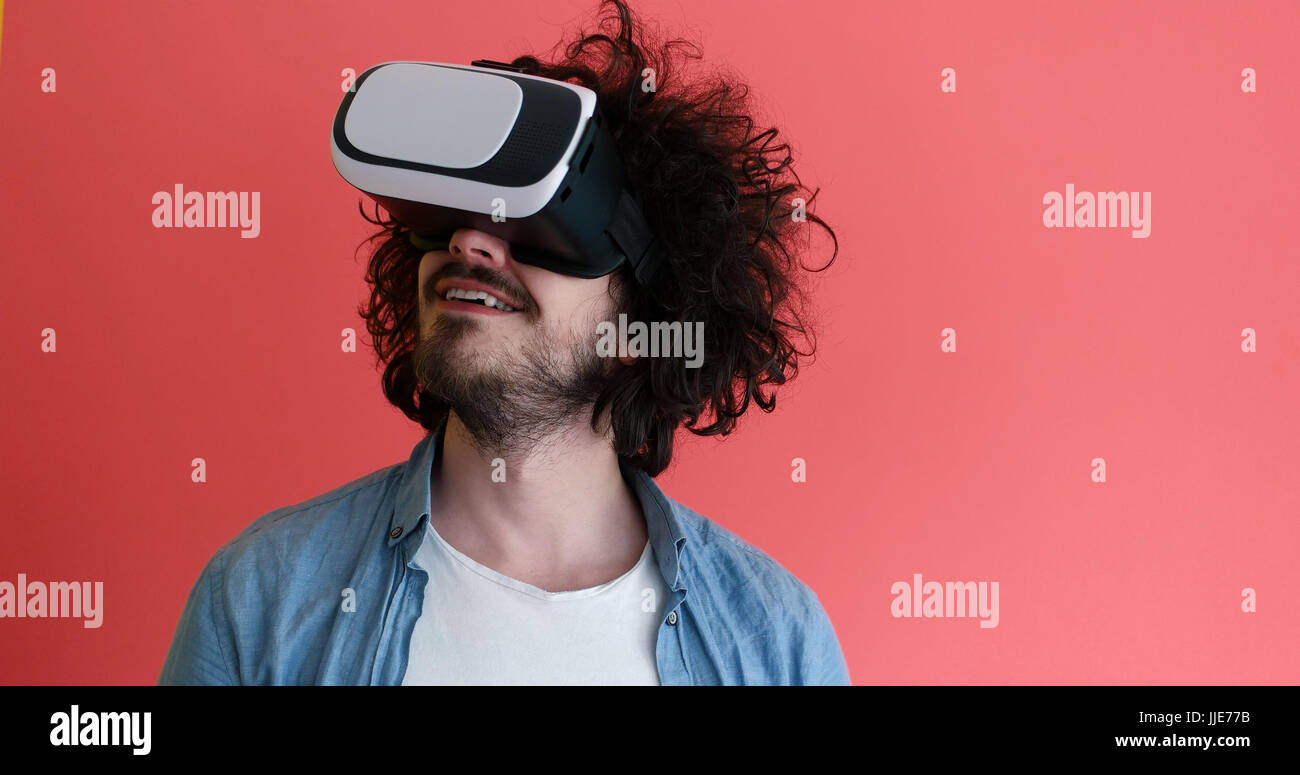 Happy man getting experience using VR headset glasses of virtual ...