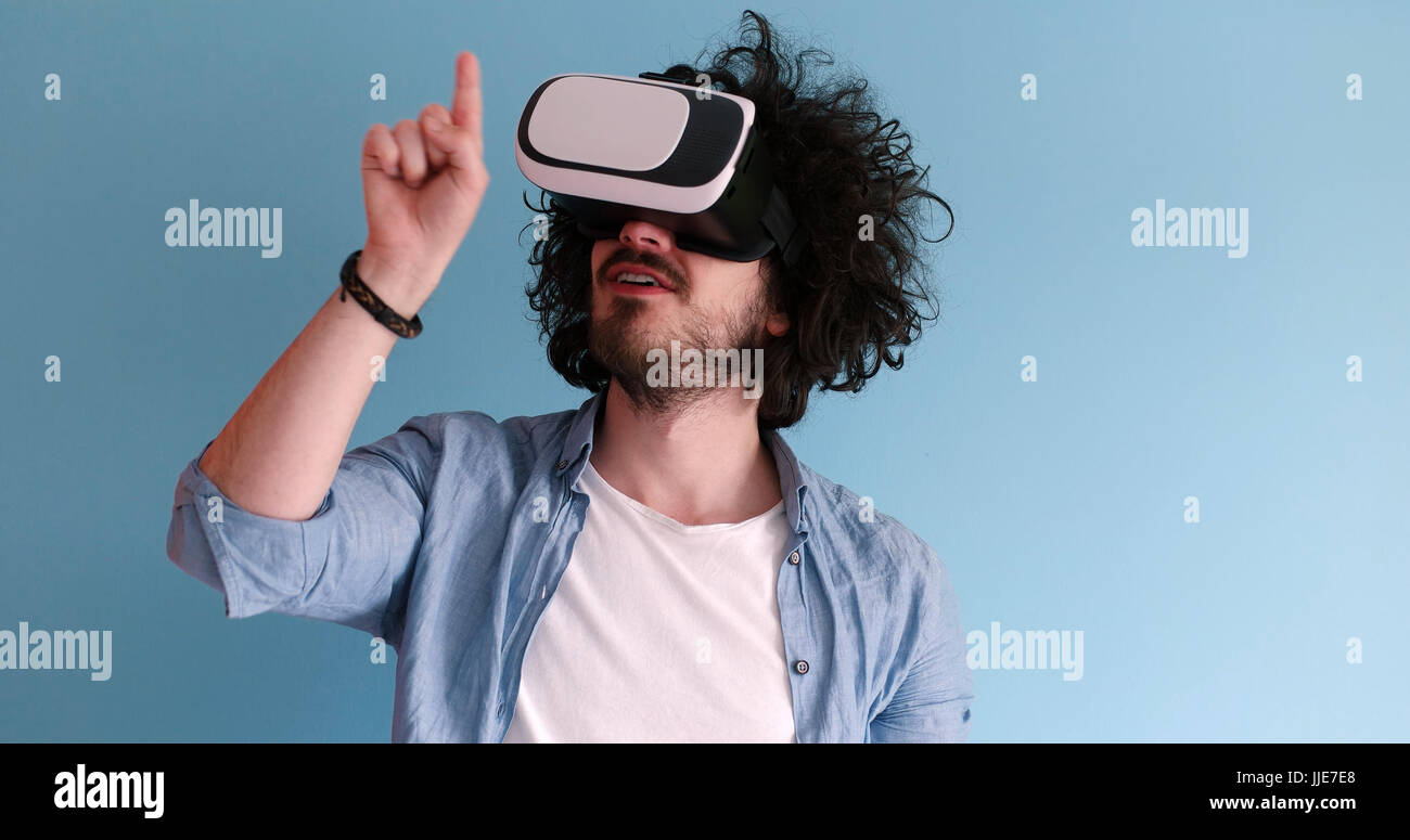 Happy man getting experience using VR headset glasses of virtual ...
