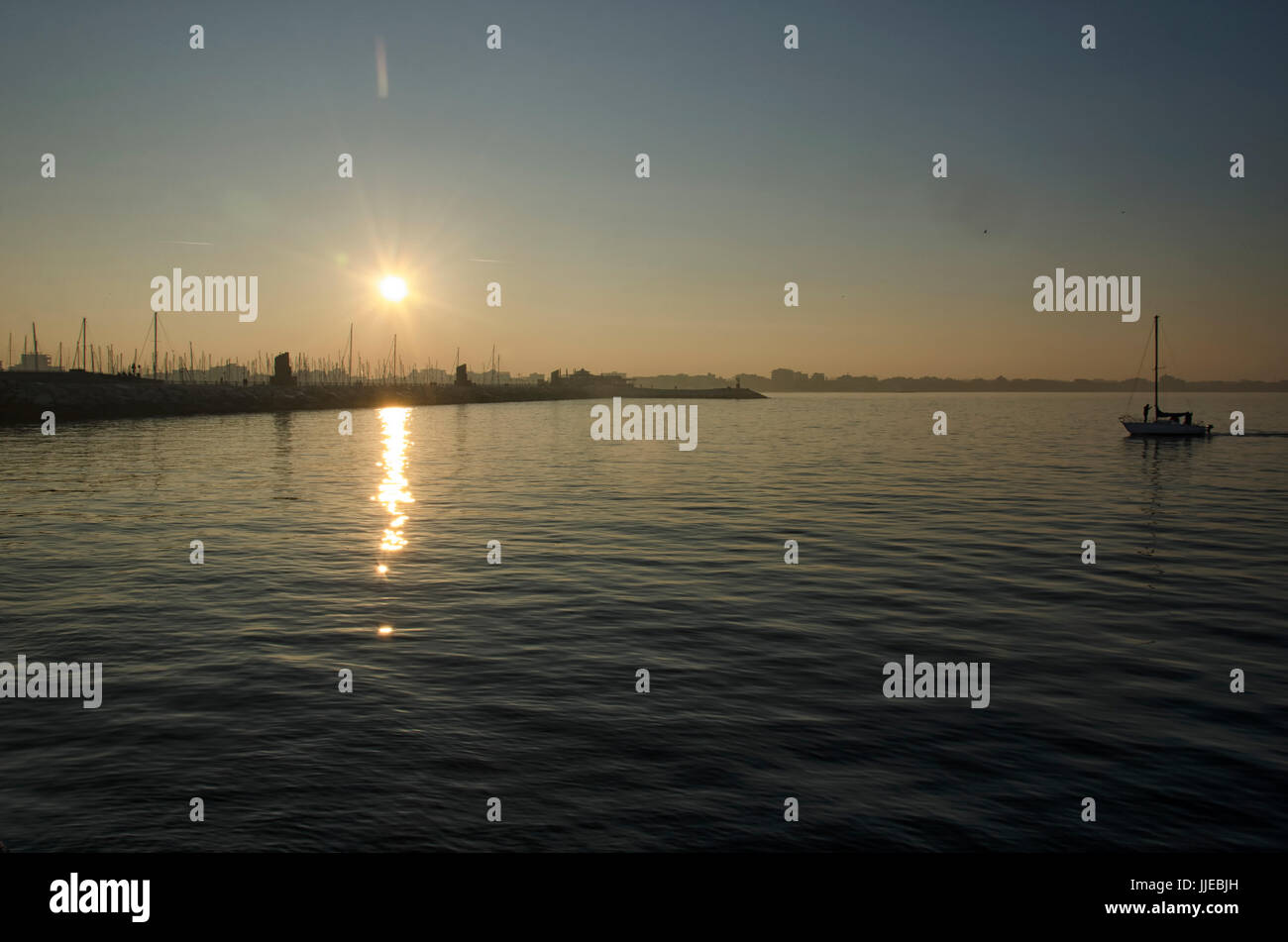 View of sunset over the port of Rimini Stock Photo - Alamy