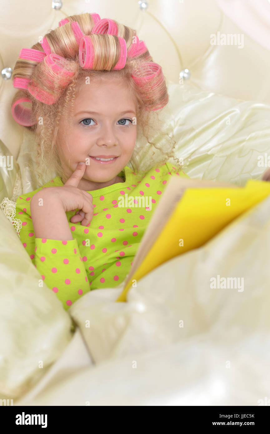 Cute little girl reading book Stock Photo - Alamy