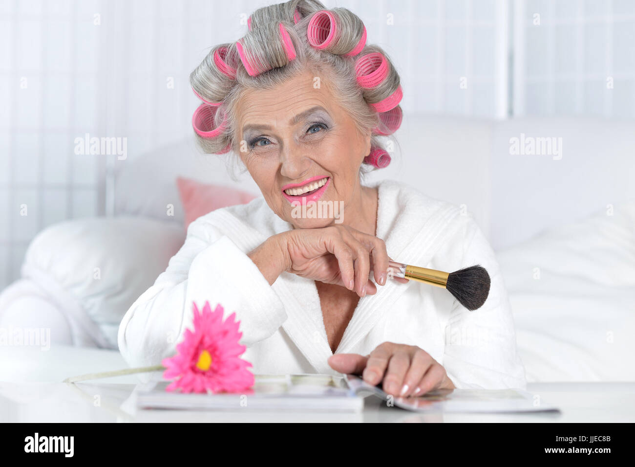 Old lady reading magazine hi-res stock photography and images - Alamy