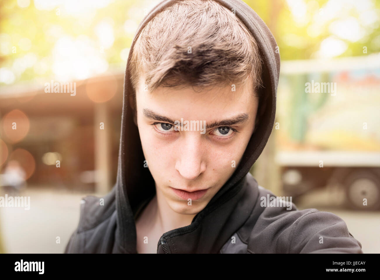 portrait of a cool looking young man with hoodie Stock Photo - Alamy