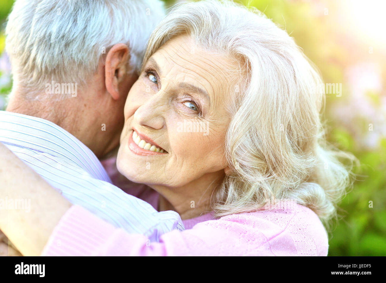 senior couple hugging Stock Photo - Alamy