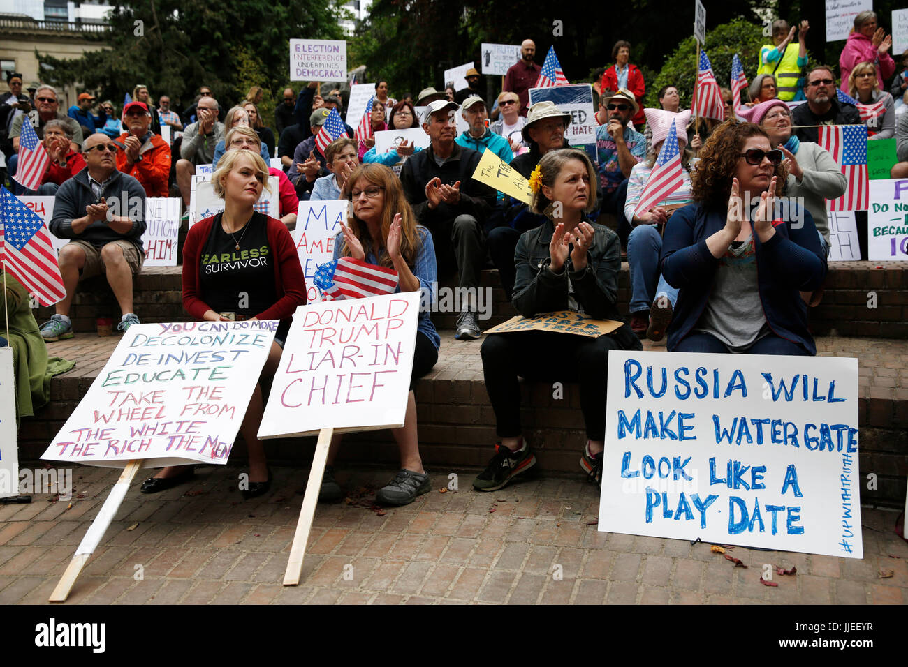 People protest against President Donald Trump at a March for Truth ...