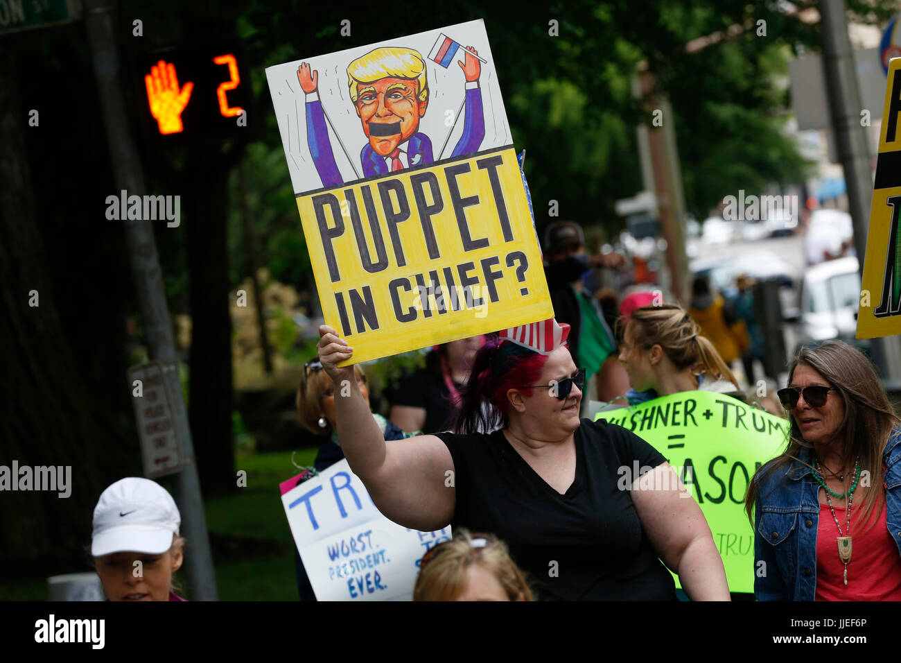 People protest against President Donald Trump at a March for Truth ...