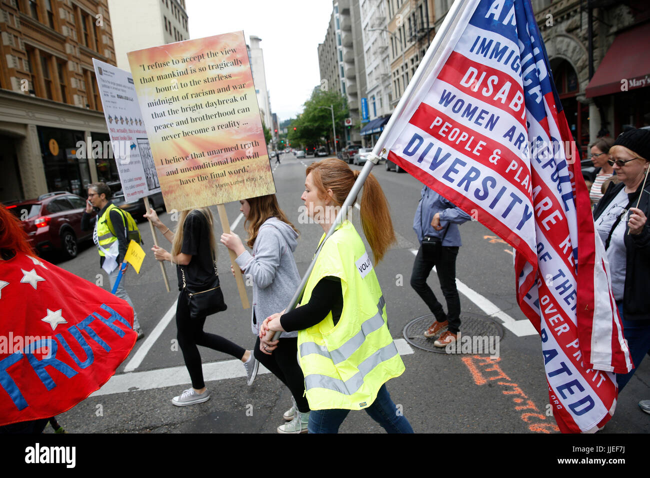 People protest against President Donald Trump at a March for Truth ...