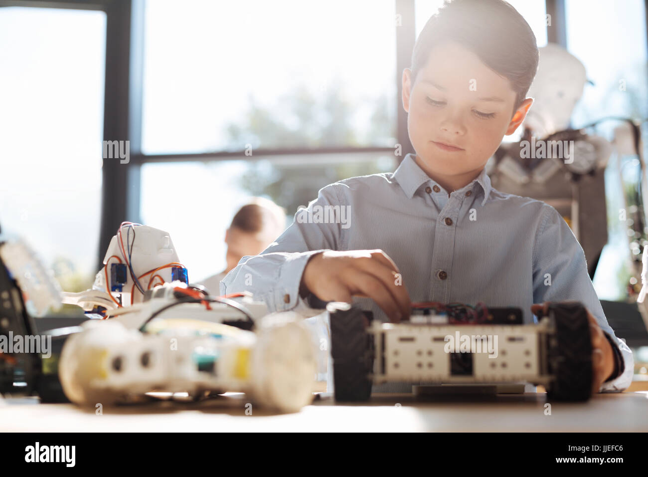 Little boy constructing his own robot Stock Photo - Alamy