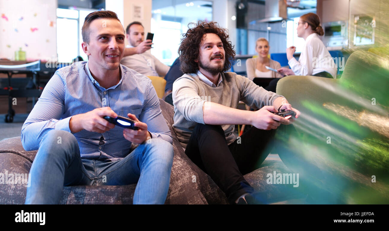 Work hard play hard. Office Workers Playing computer games Stock Photo ...