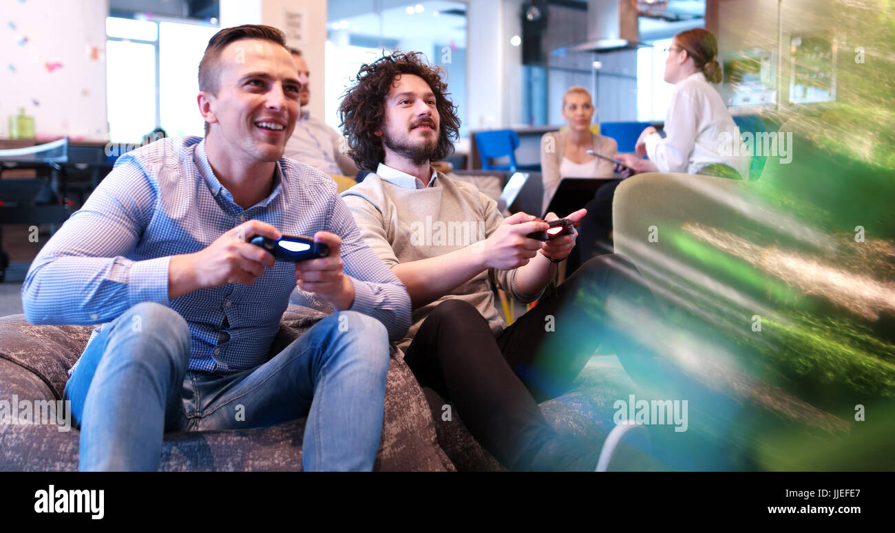 Work hard play hard. Office Workers Playing computer games Stock Photo ...