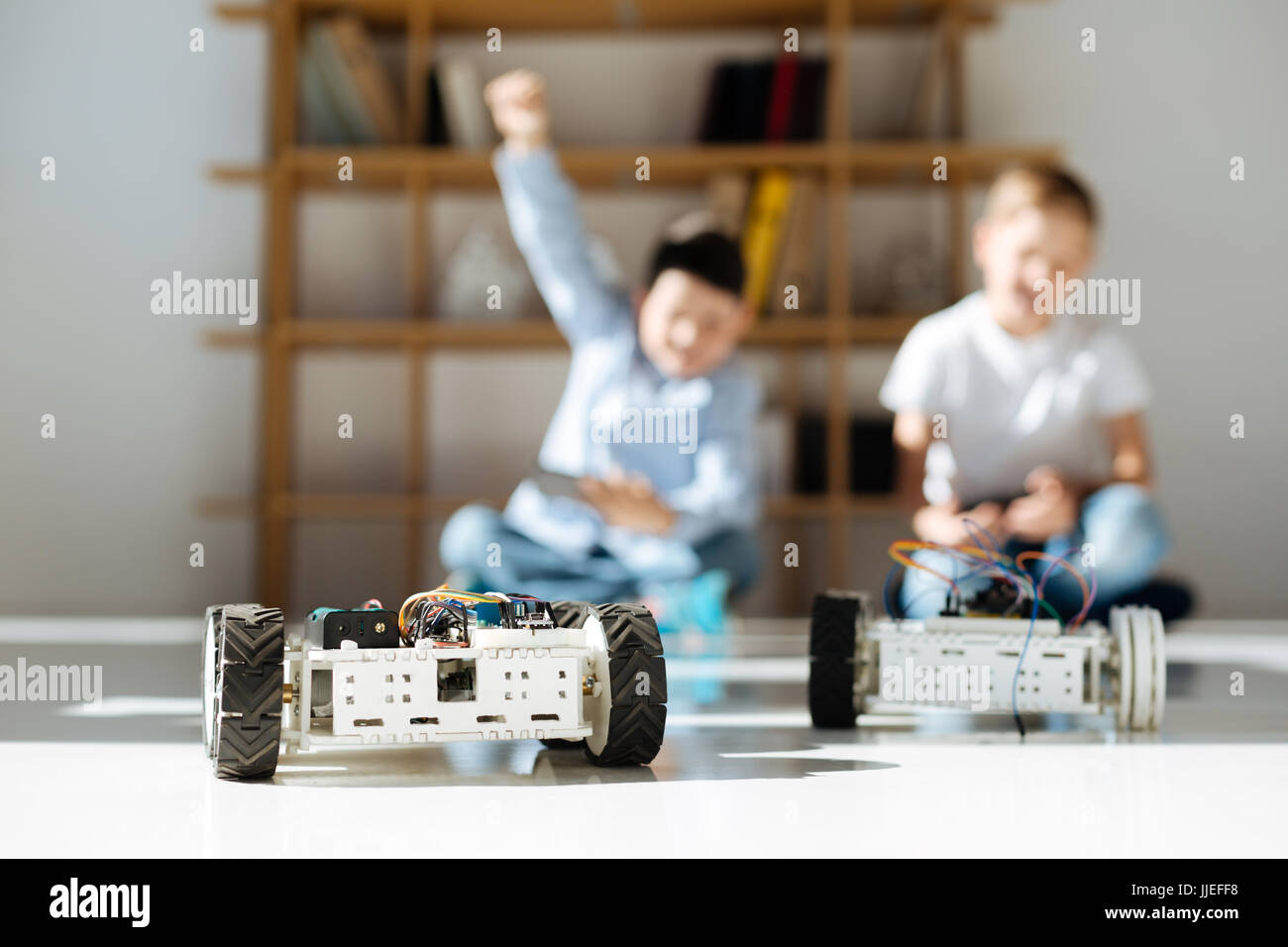 Little boy celebrating victory in a racing game Stock Photo - Alamy
