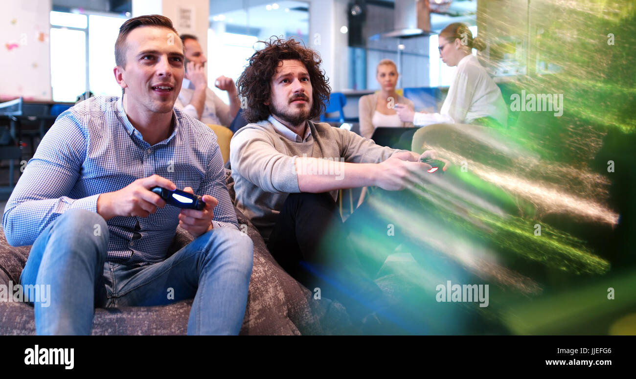 Work hard play hard. Office Workers Playing computer games Stock Photo ...