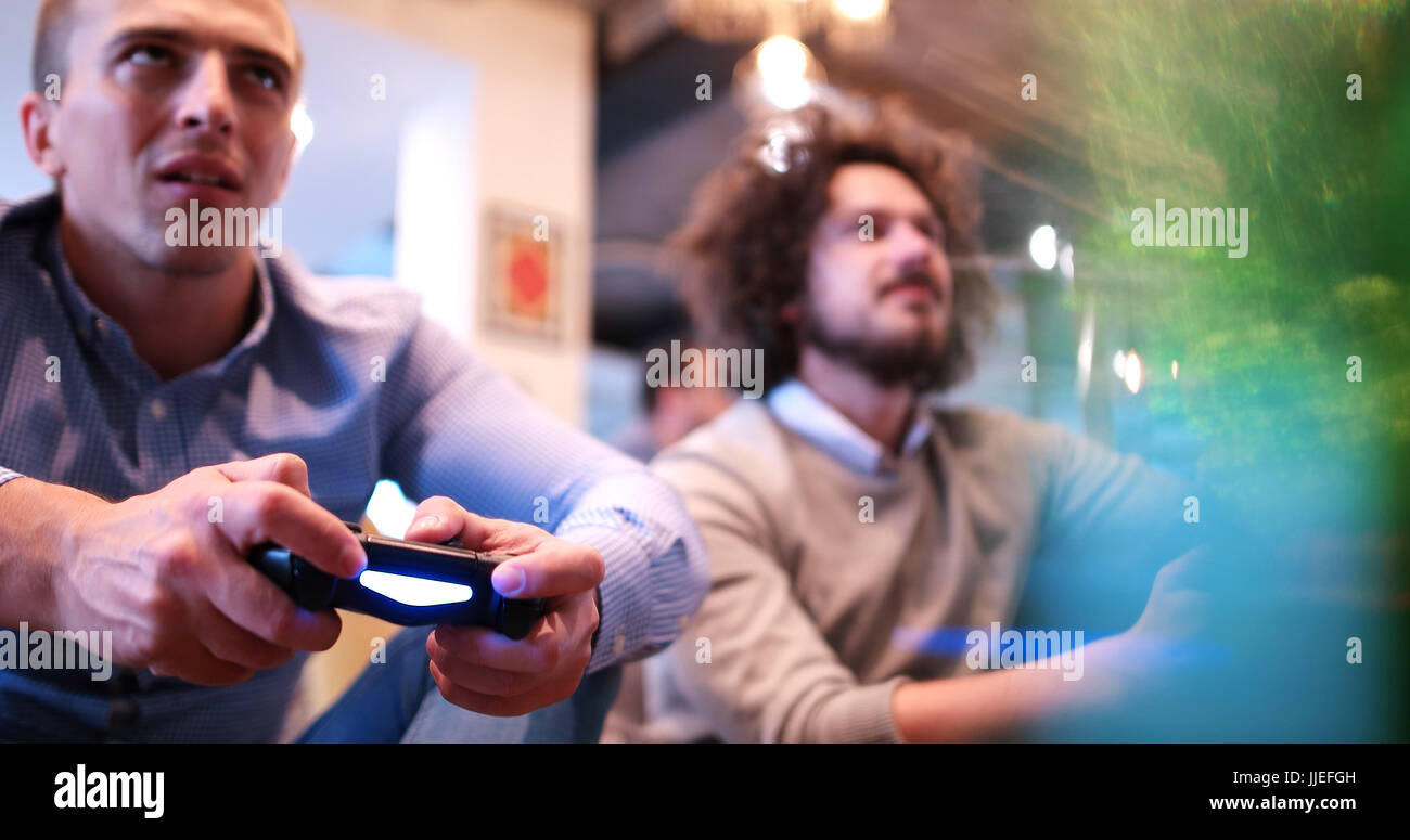 Work hard play hard. Office Workers Playing computer games Stock Photo ...