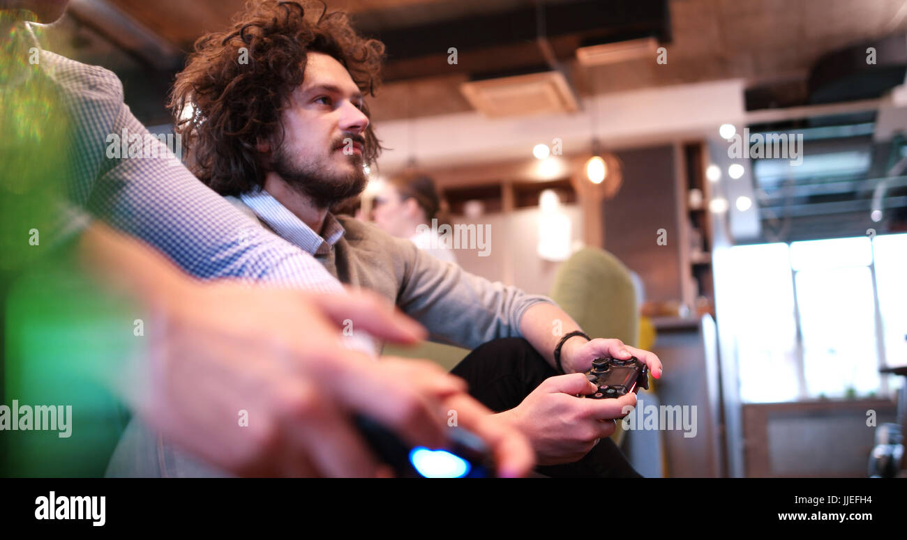Work hard play hard. Office Workers Playing computer games Stock Photo ...