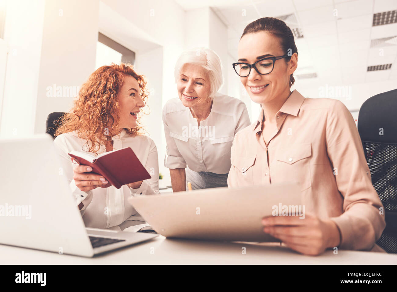 Professional ambitious ladies working in team Stock Photo - Alamy