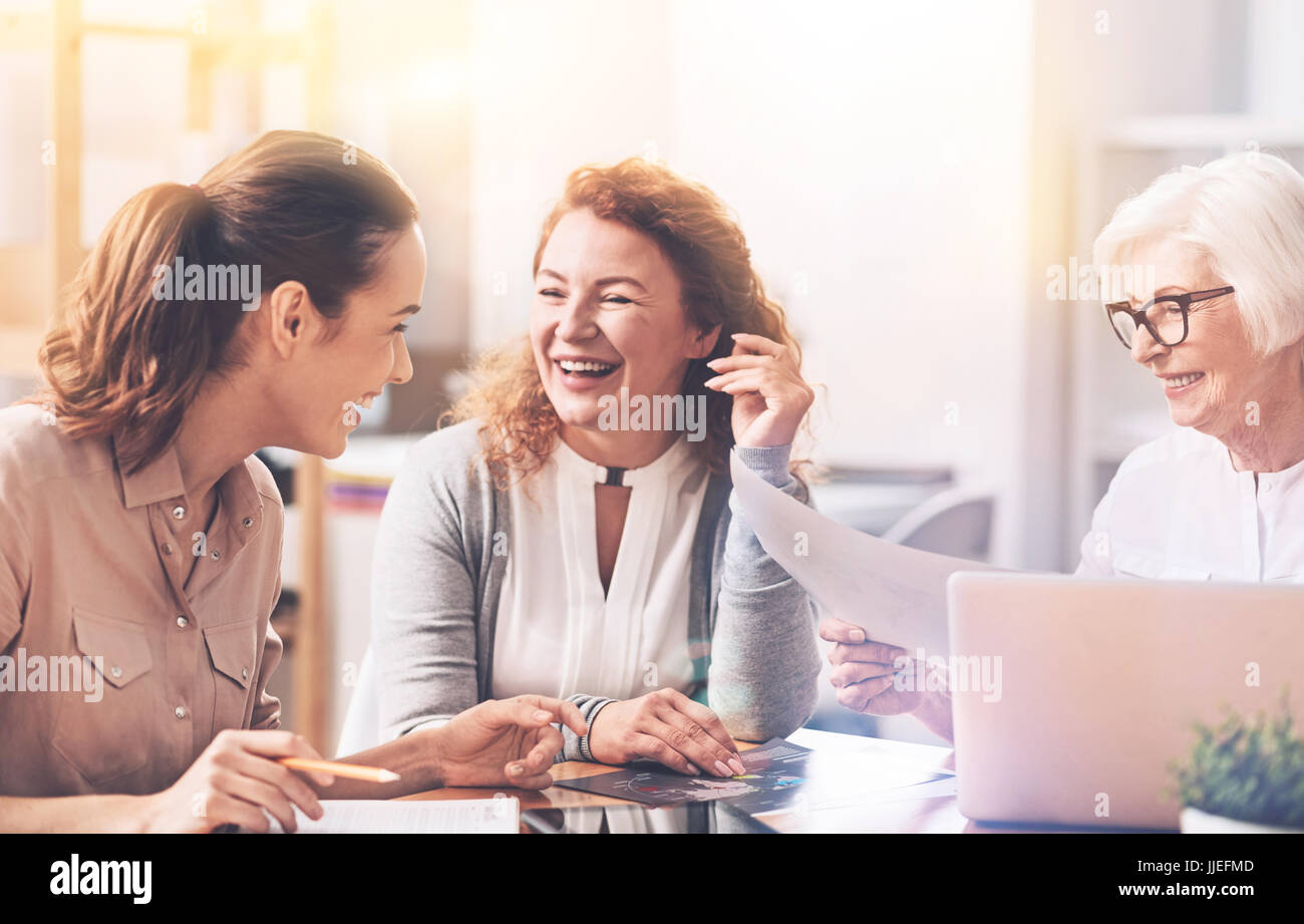 Emotional passionate colleagues laughing at joke Stock Photo - Alamy