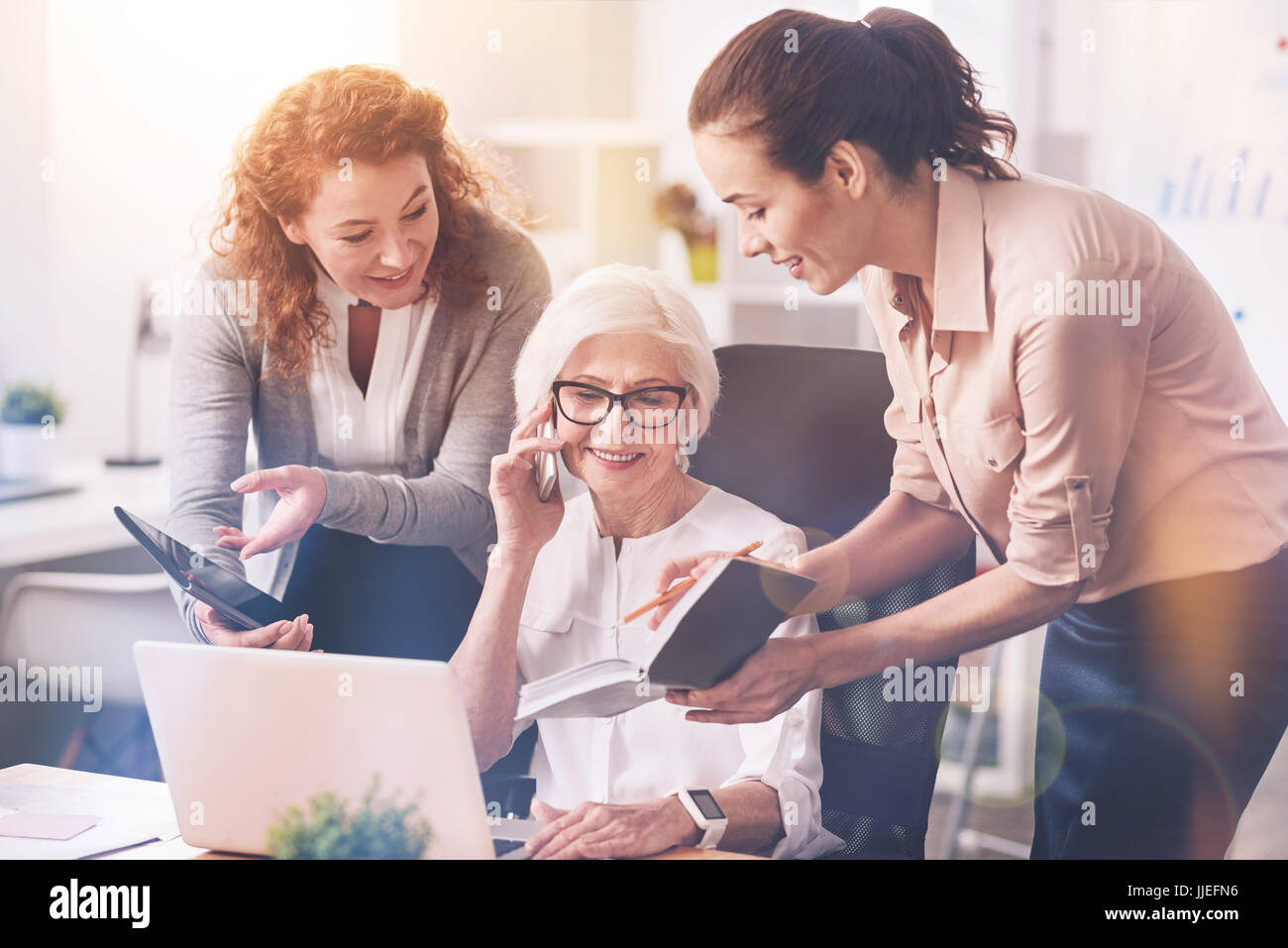 Experienced hardworking executive having a busy working day Stock Photo ...