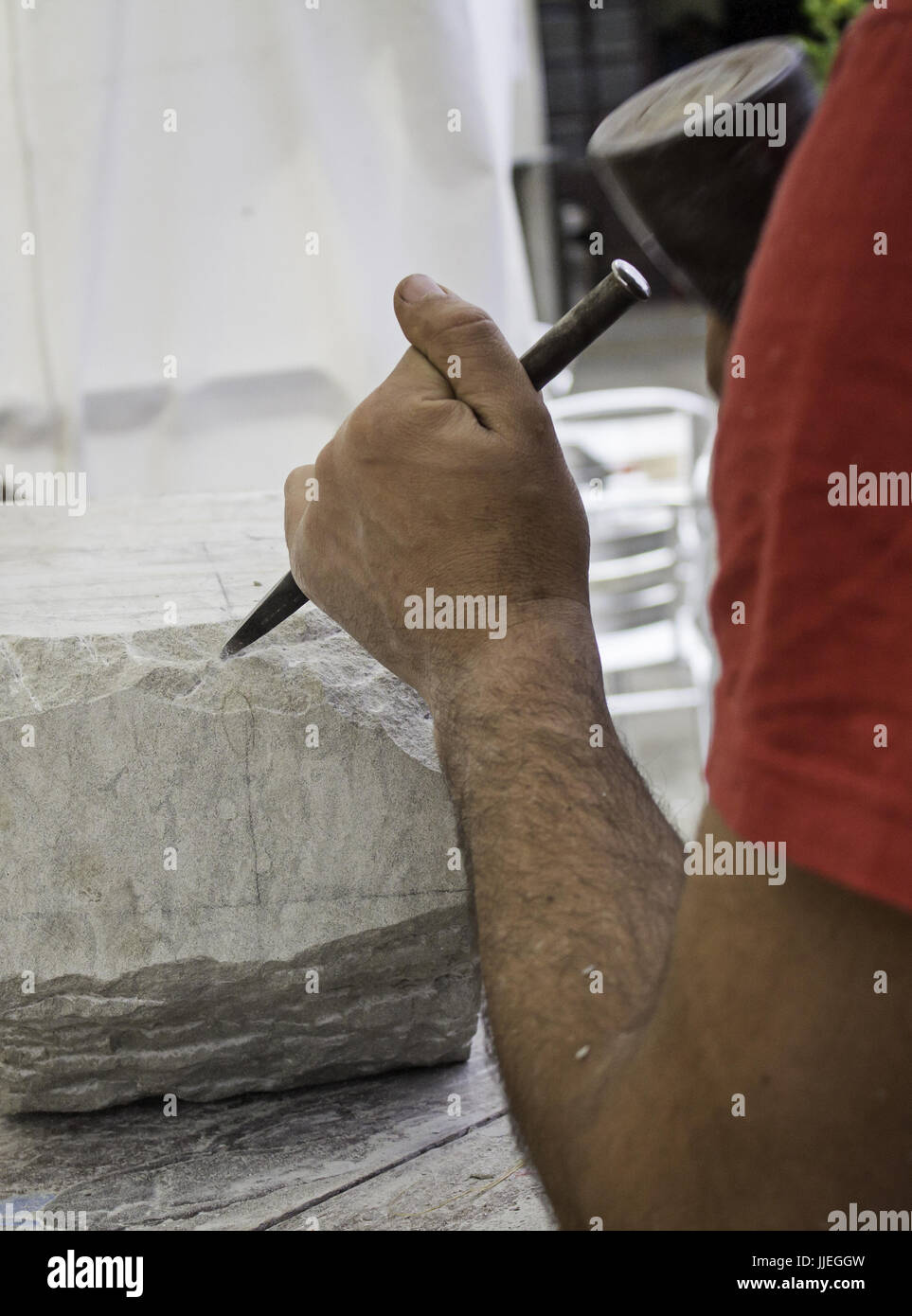Man working and carving stone, craft detail, creation and creativity ...