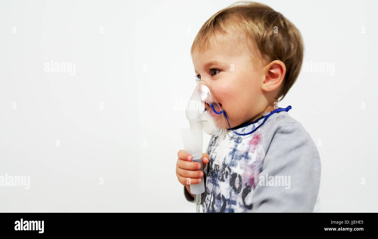 Happy kid inhaling aerosol Stock Photo - Alamy