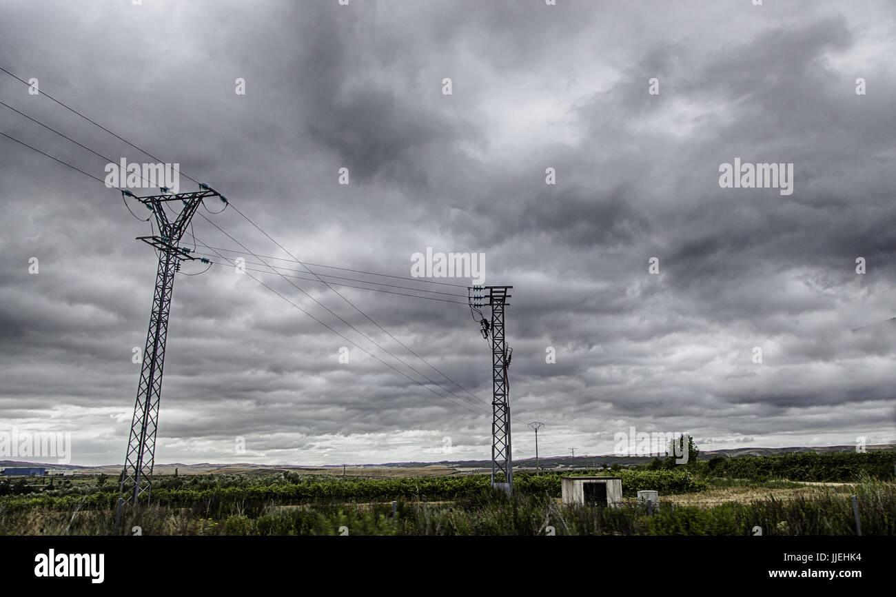 Electrical towers in a storm, electricity transport detail Stock Photo ...