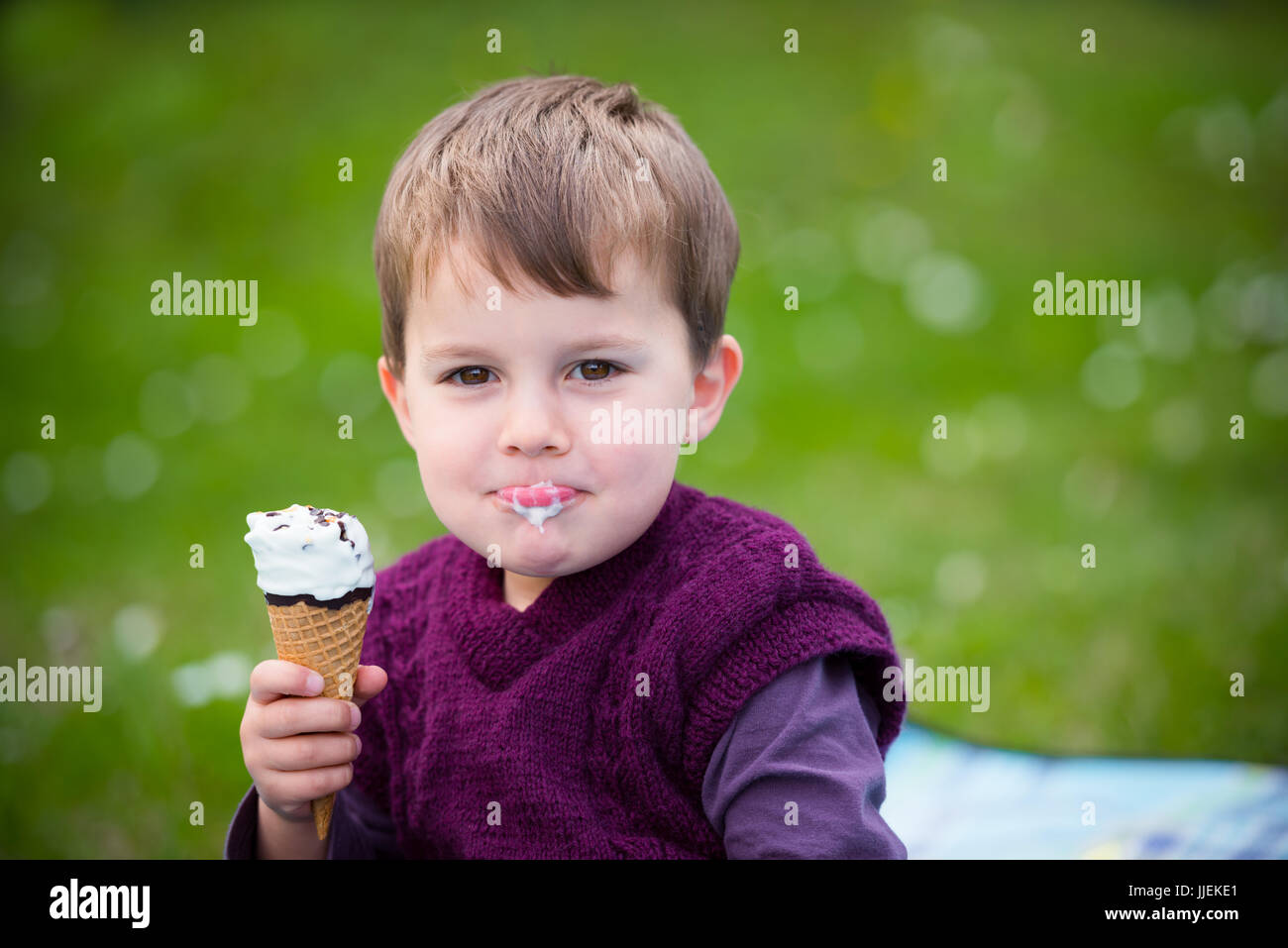 Close up of child eating ice cream Stock Photo - Alamy