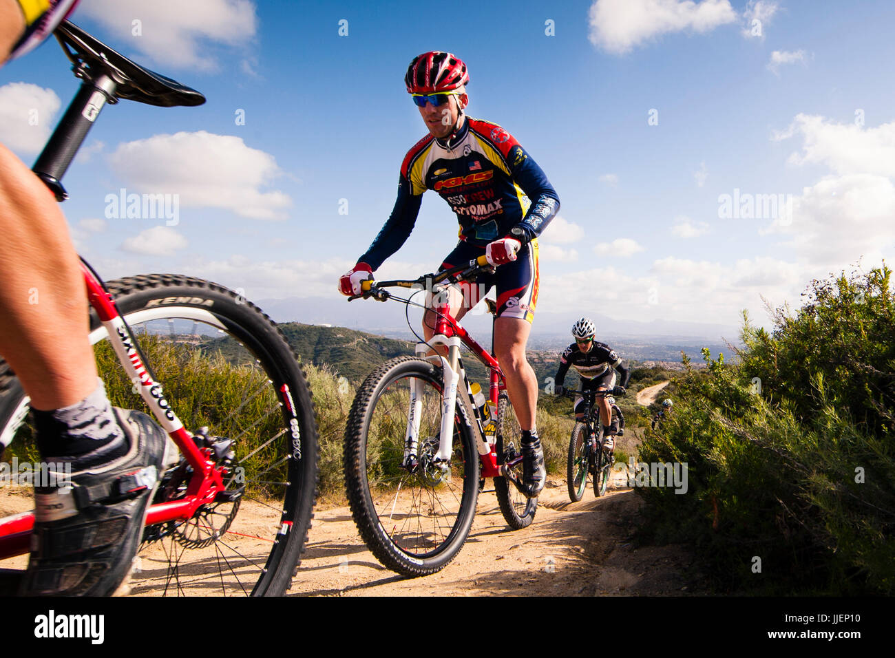 Riding bike in middle of road hi-res stock photography and images - Alamy