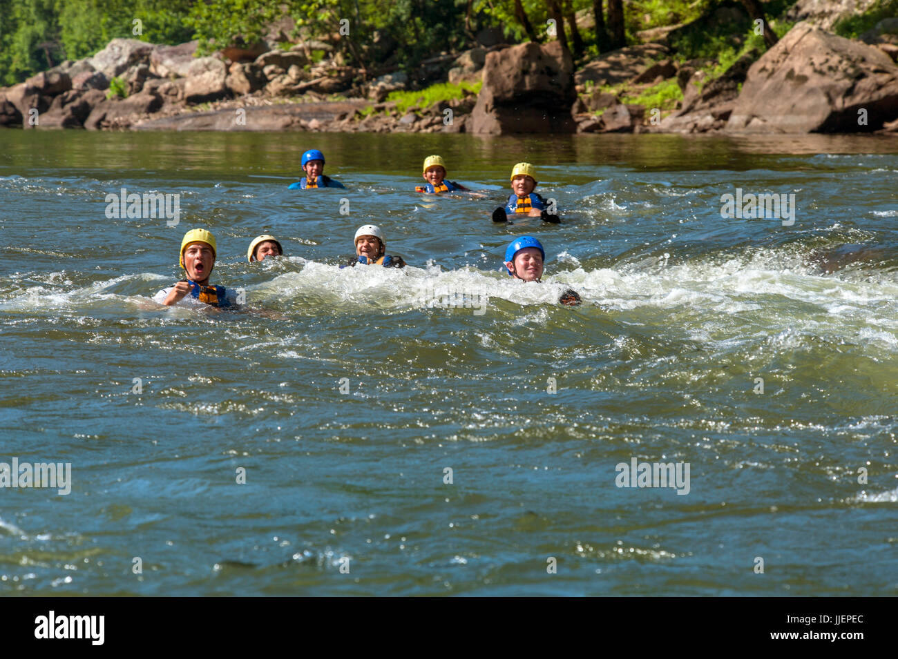 Order of the Arrow scouts float through a small rapids of the New River ...