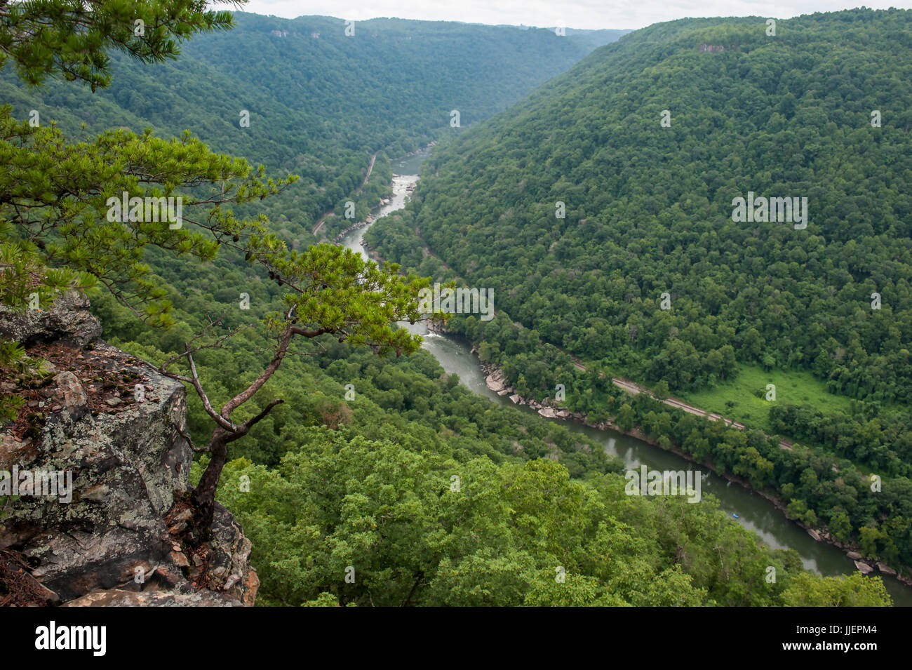A rocky outcrop looks over the New River Gorge and the New River, a ...