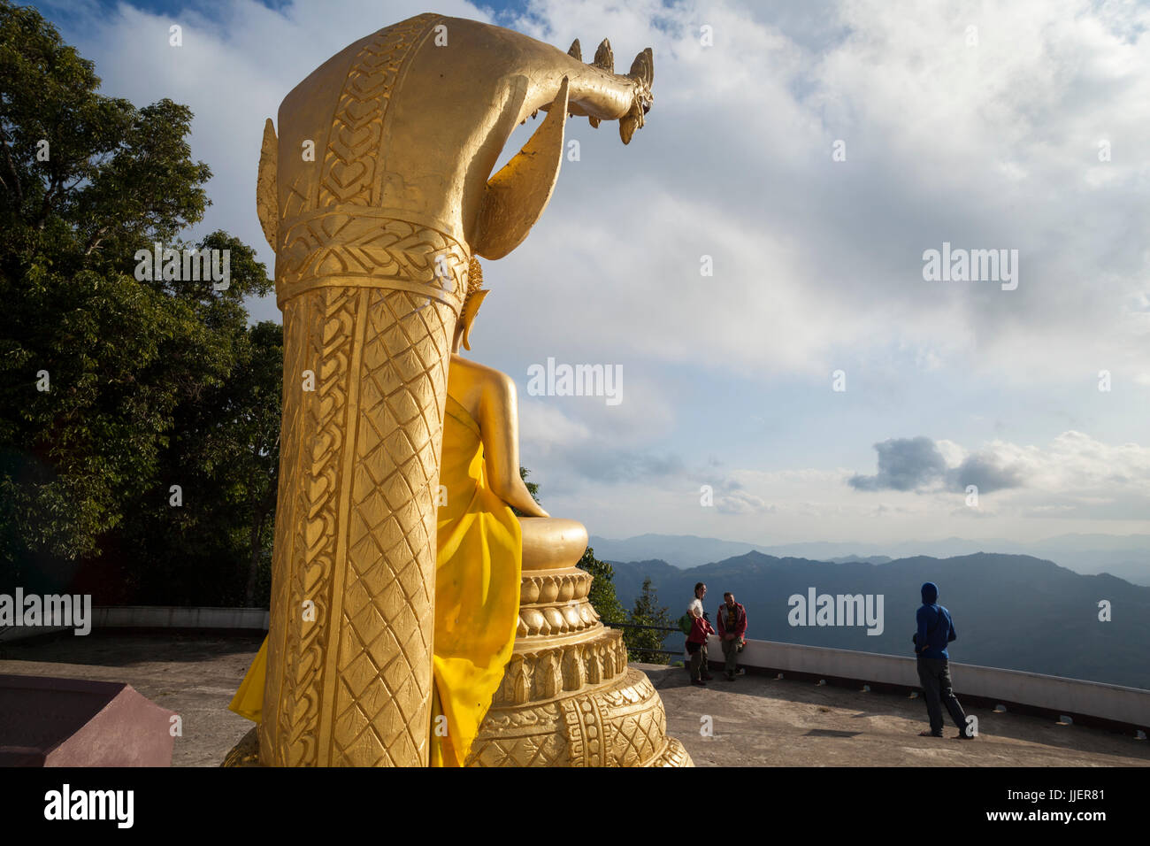 Robert Hahn (right) speaks with other foreigners at the overlook and ...