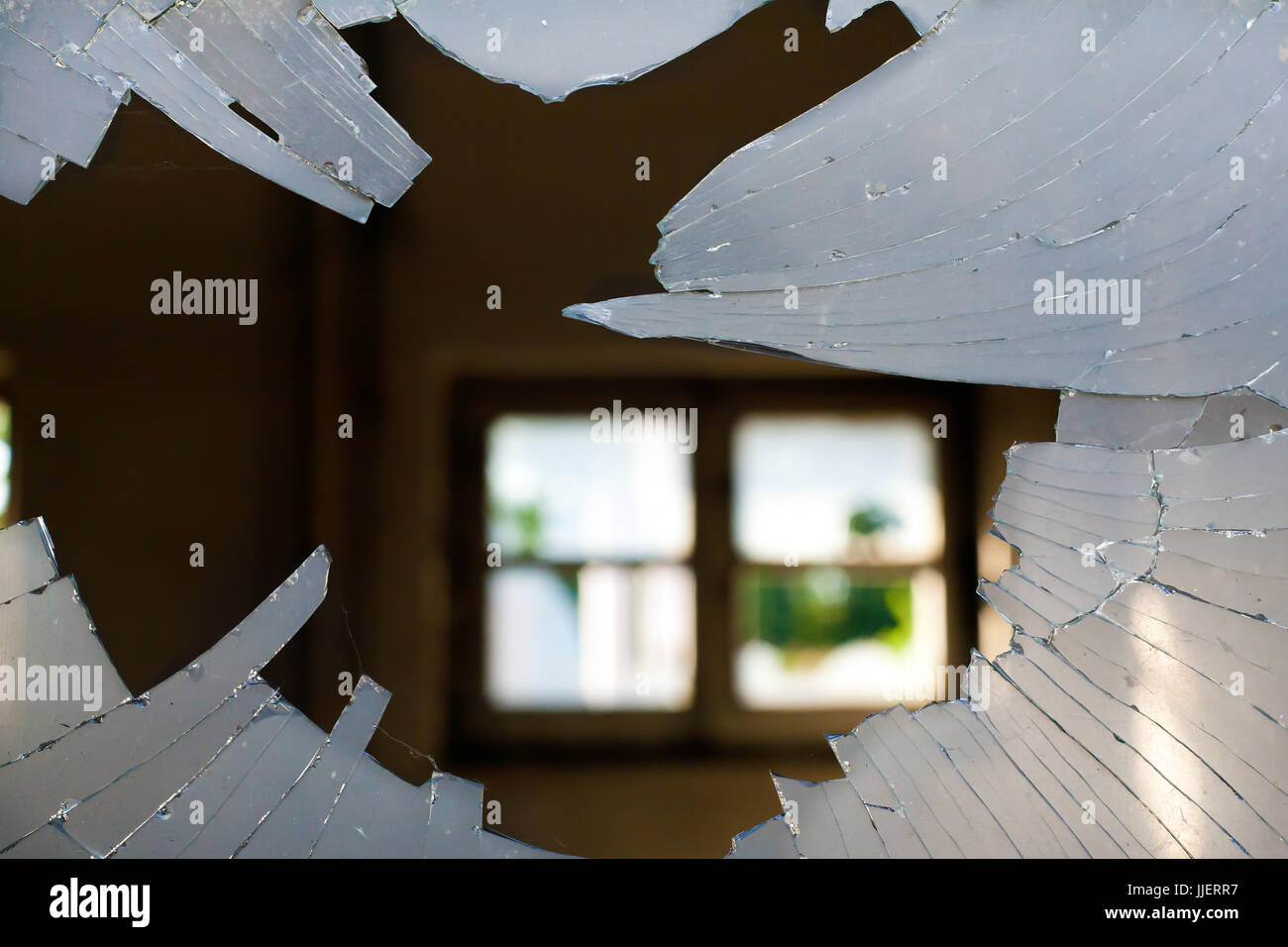 Broken Window Glass looking inside a House with a window background ...