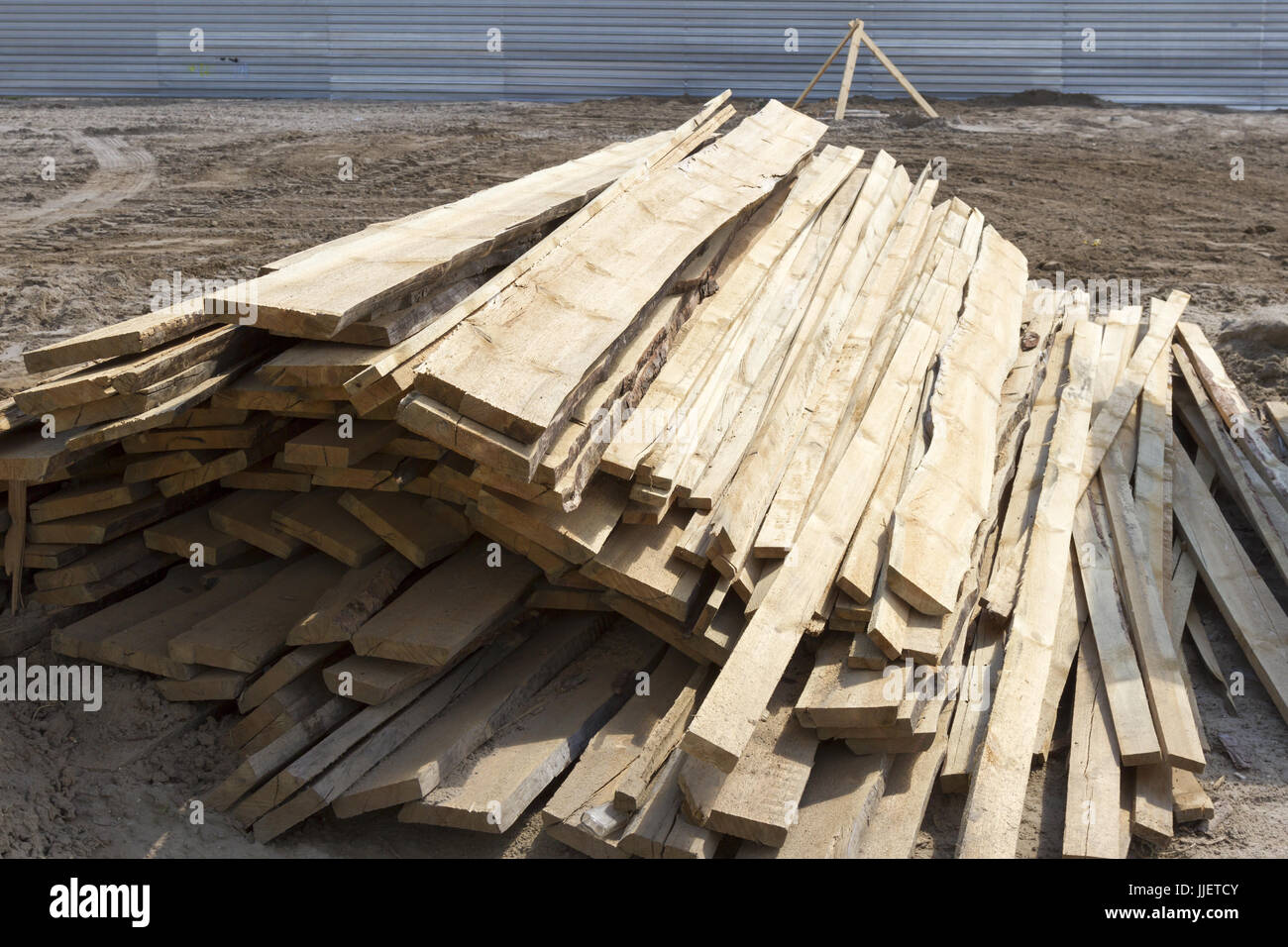 The mountain of planks on the construction site Stock Photo - Alamy