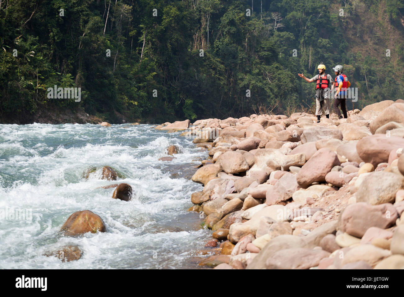 Robert Hahn (left) and Mung discuss possible descent routes at a steep ...