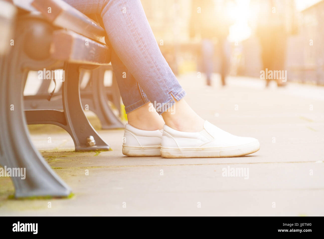 Person sitting on street bench city hi-res stock photography and images ...