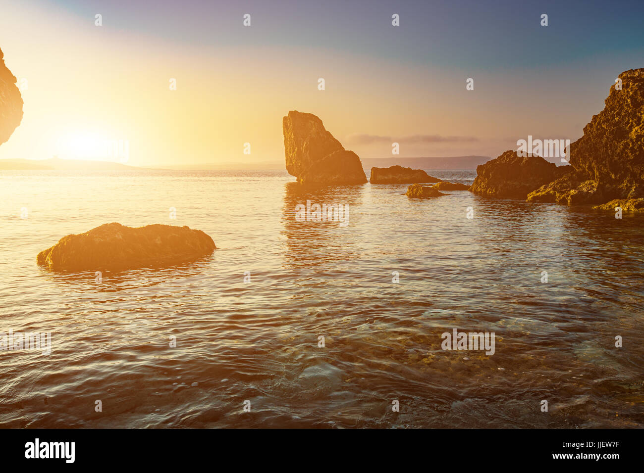 nature rocks sea sky sunset sunrise ocean Stock Photo - Alamy