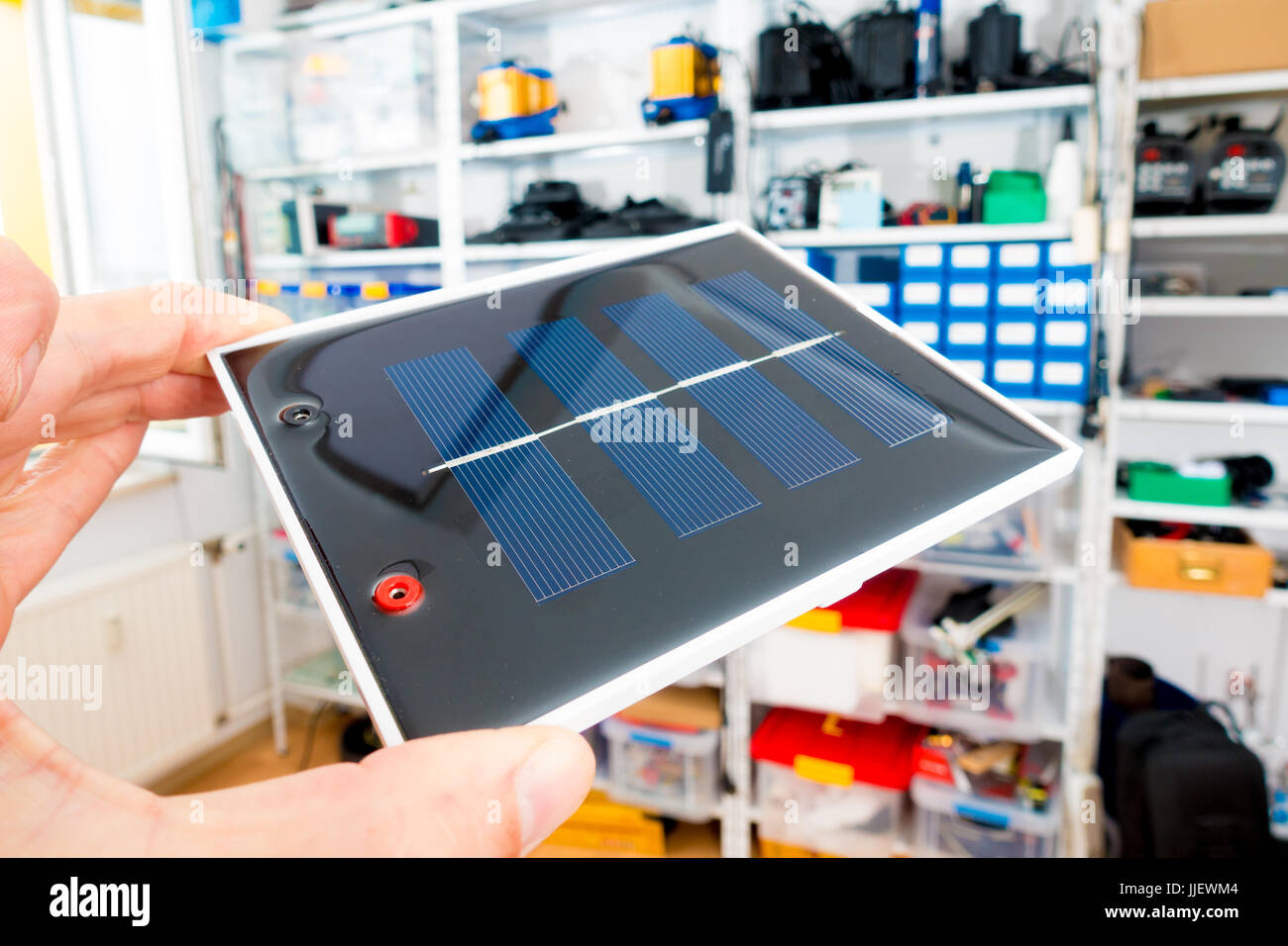 portable solar cell in hand Stock Photo - Alamy
