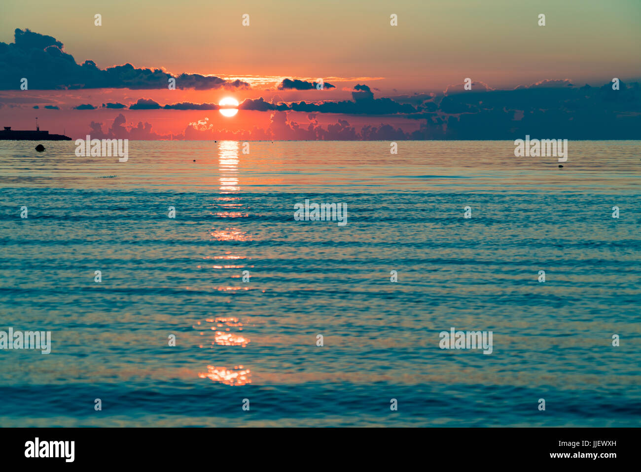 Sunset on sea Stock Photo - Alamy