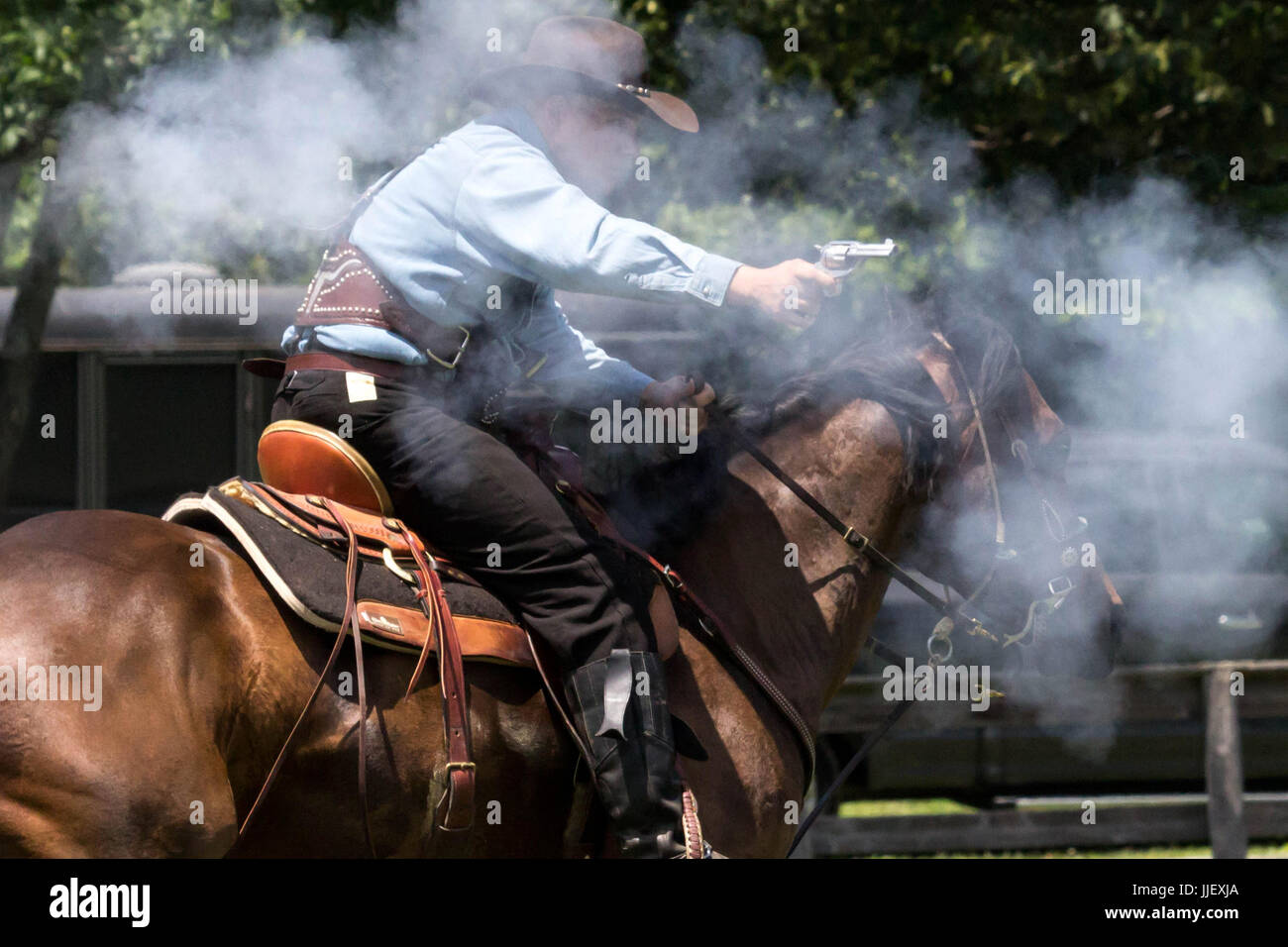 Cowboy Riding Horse Gun High Resolution Stock Photography and Images ...
