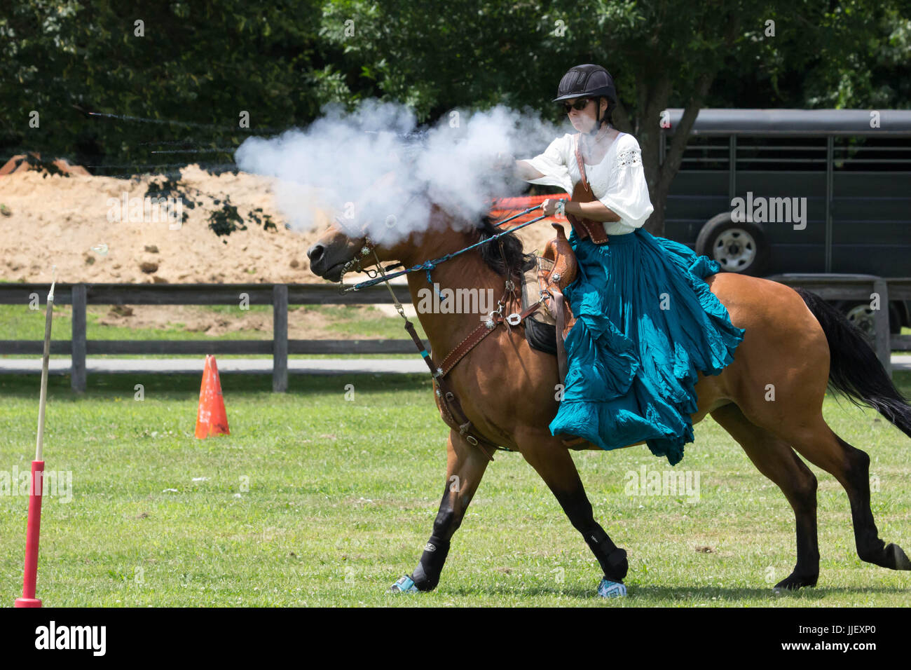 Cowboy riding horse shooting gun hi-res stock photography and images ...